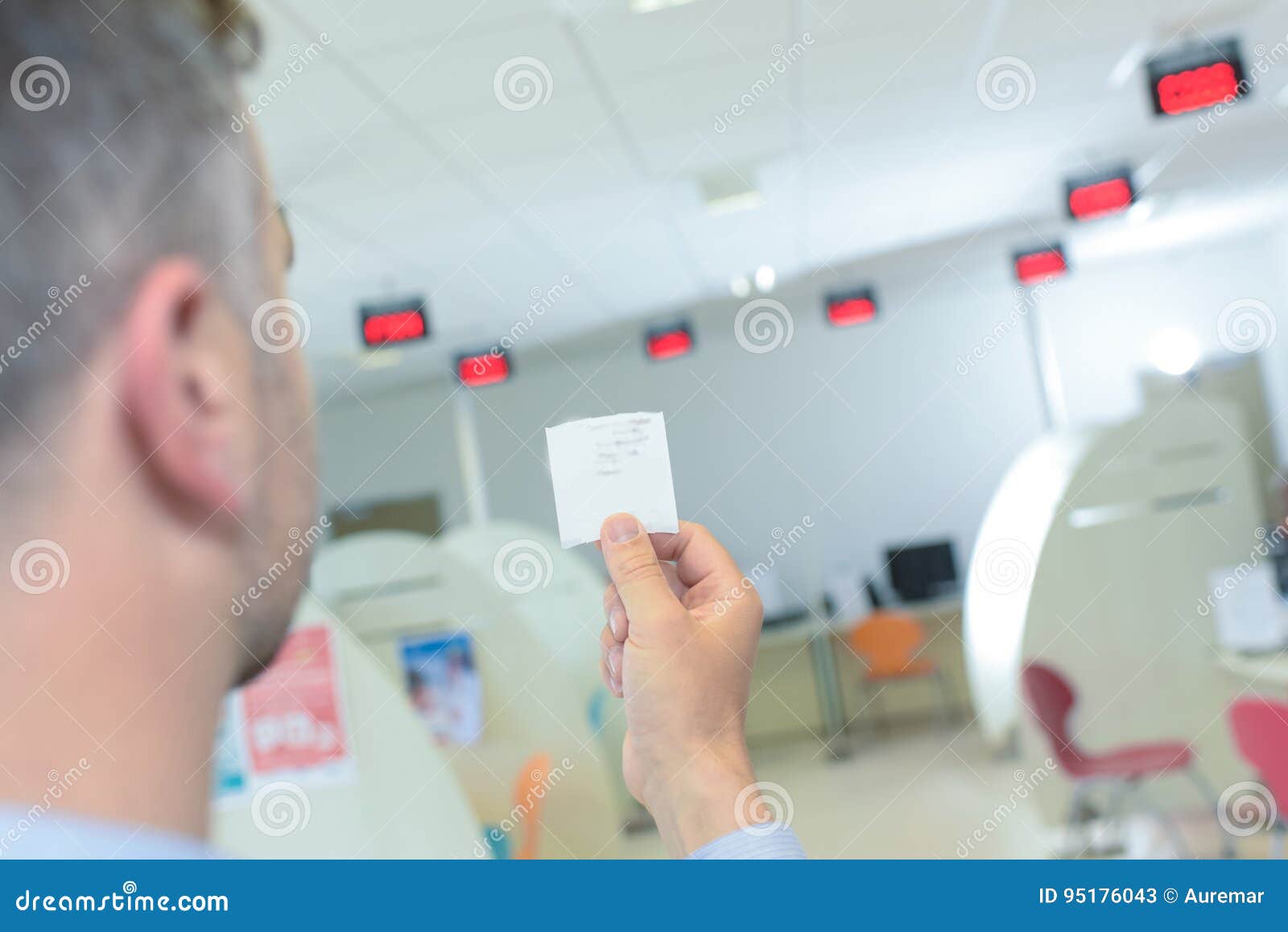 Man Holding Ticket for Turn in Queue Stock Image - Image of indoor ...
