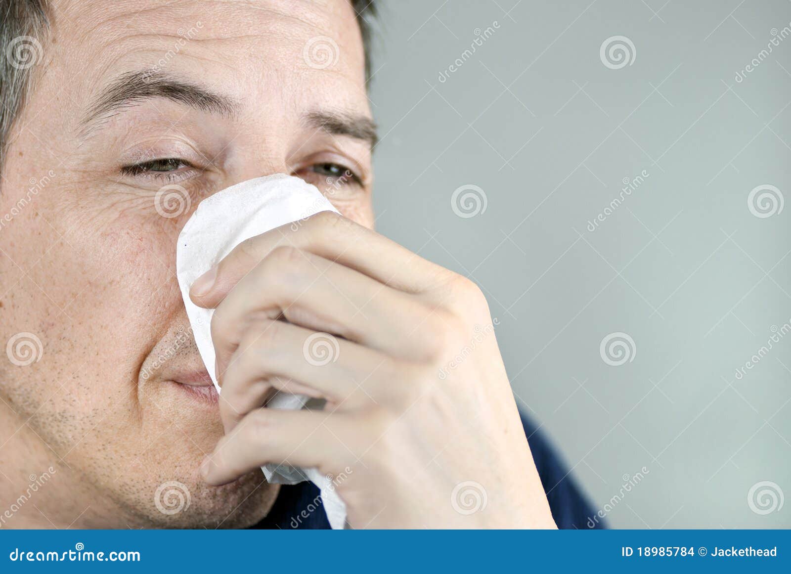 Man Holding Tissue on Nose stock photo. Image of contagious - 18985784