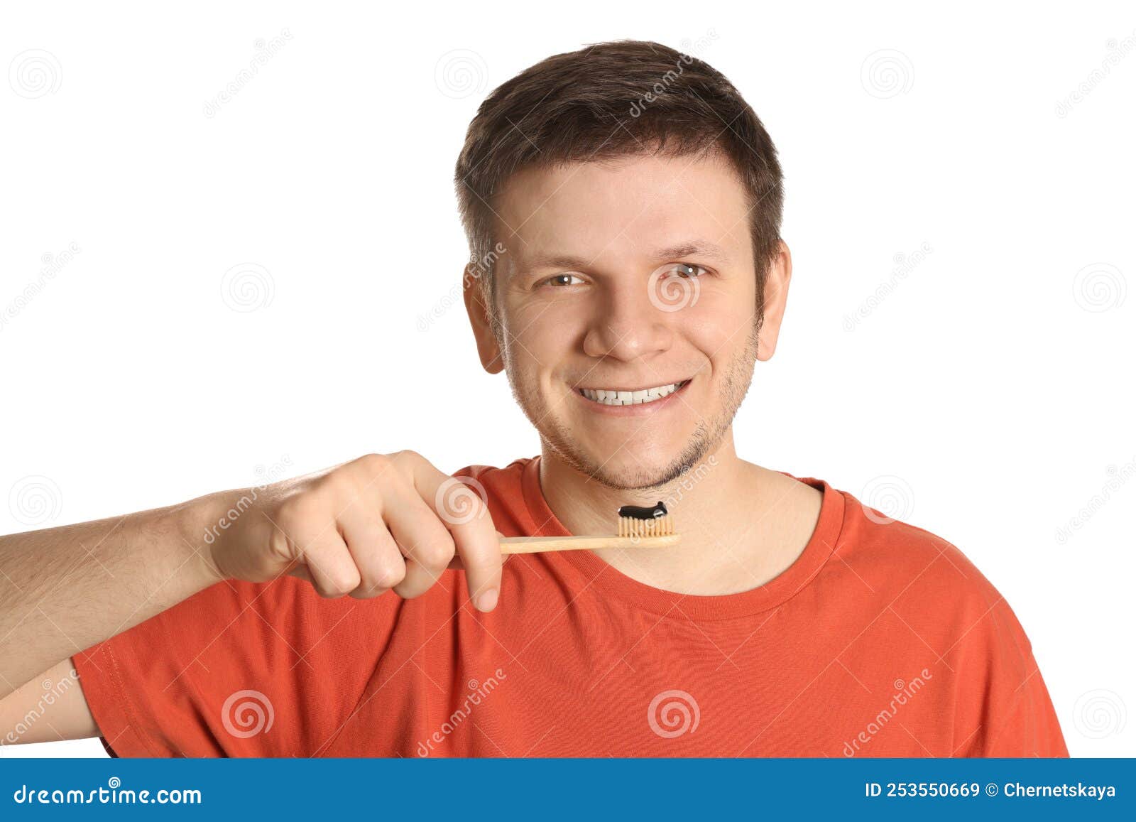Man Holding Toothbrush with Charcoal Toothpaste on White Background ...