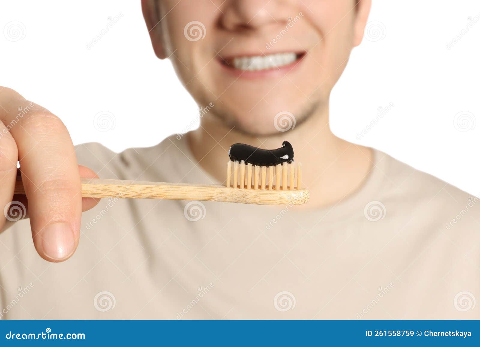 Man Holding Toothbrush with Charcoal Toothpaste on White Background ...