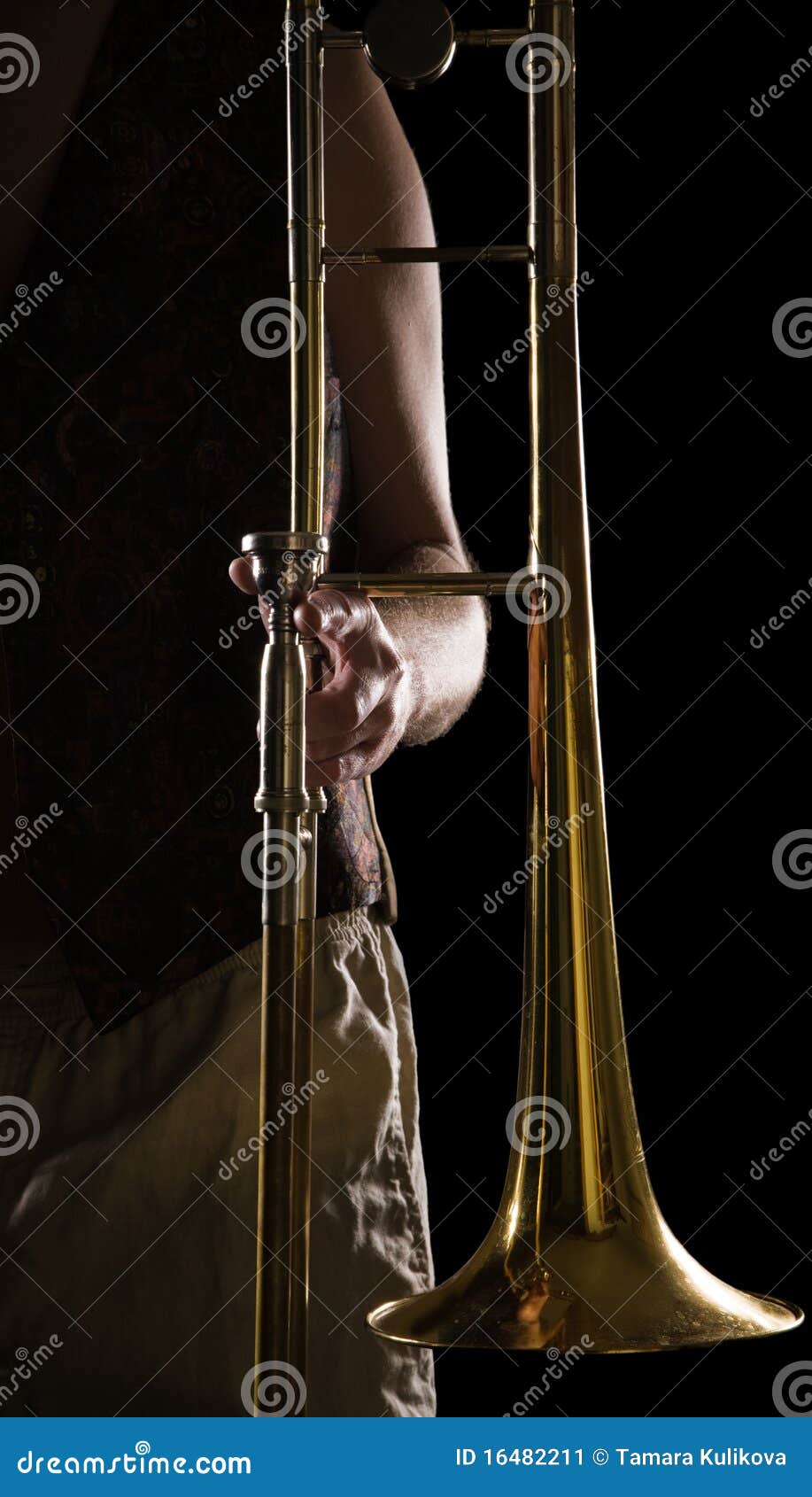 Man holding a trombone stock image. Image of shining - 16482211