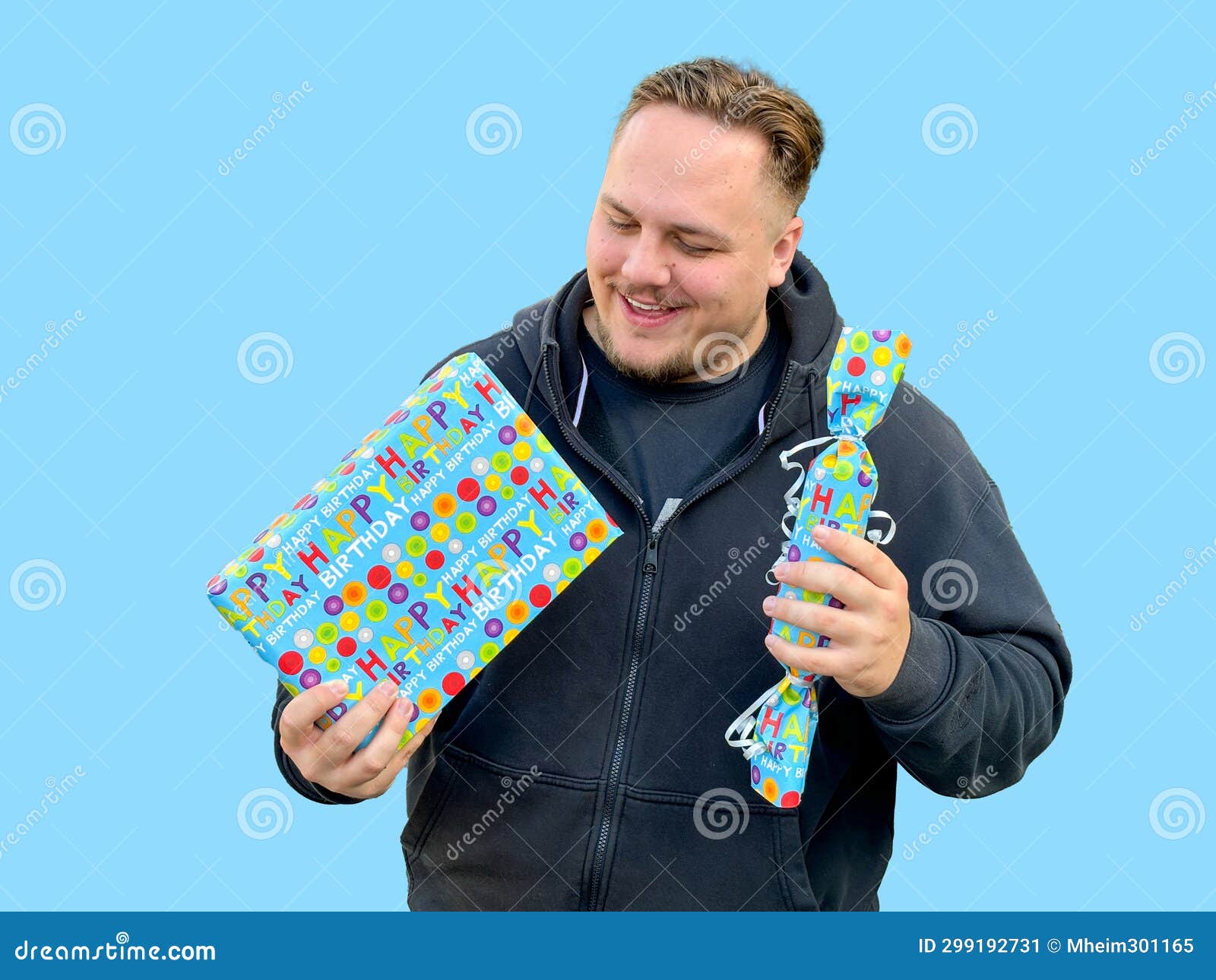 A Man Holding Two Blue Boxes with Presents in Them Stock Image - Image ...