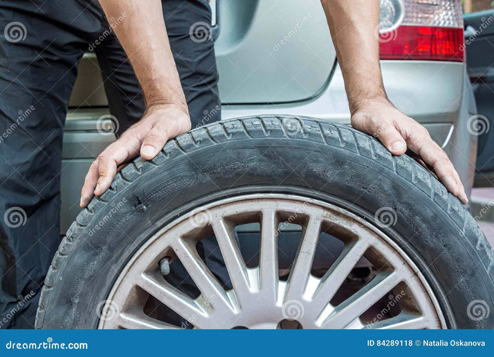 Man holding tyre stock photo. Image of transportation - 84289118