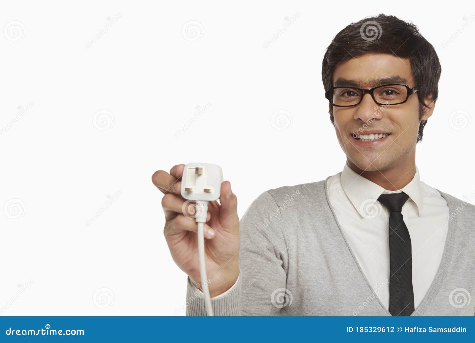 Man Holding Up an Electrical Plug Stock Photo - Image of casual ...