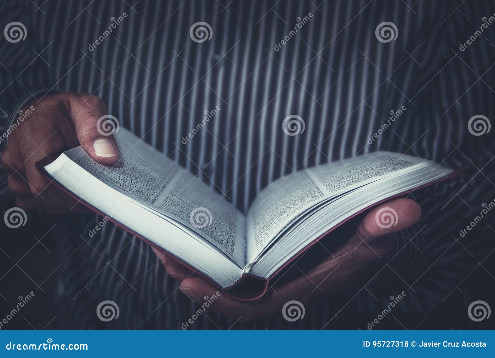 Man Holding Up an Open Bible in His Hands Stock Photo - Image of jesus ...