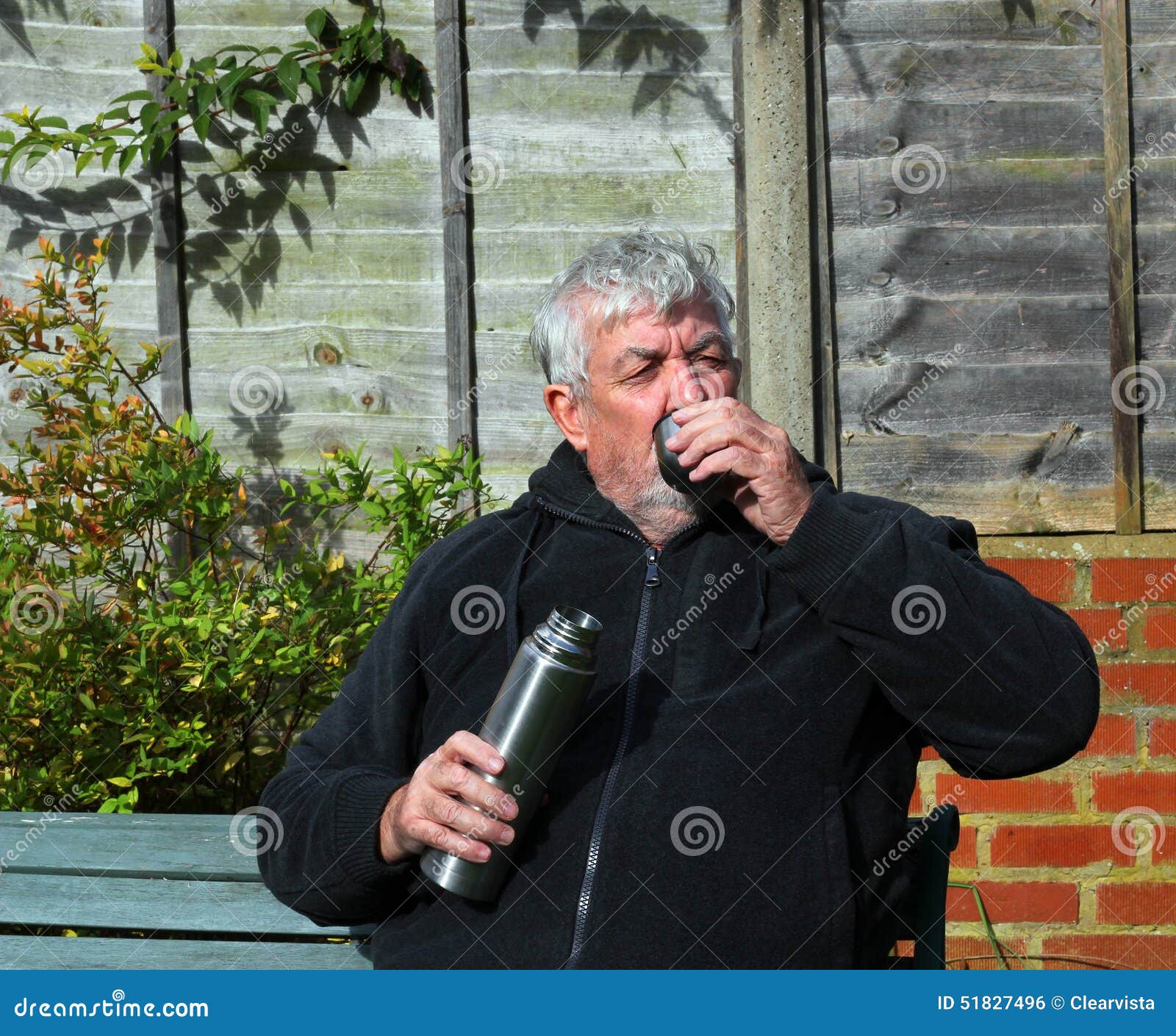 Man Holding a Vacuum Flask and Drinking.. Stock Photo - Image of steel ...