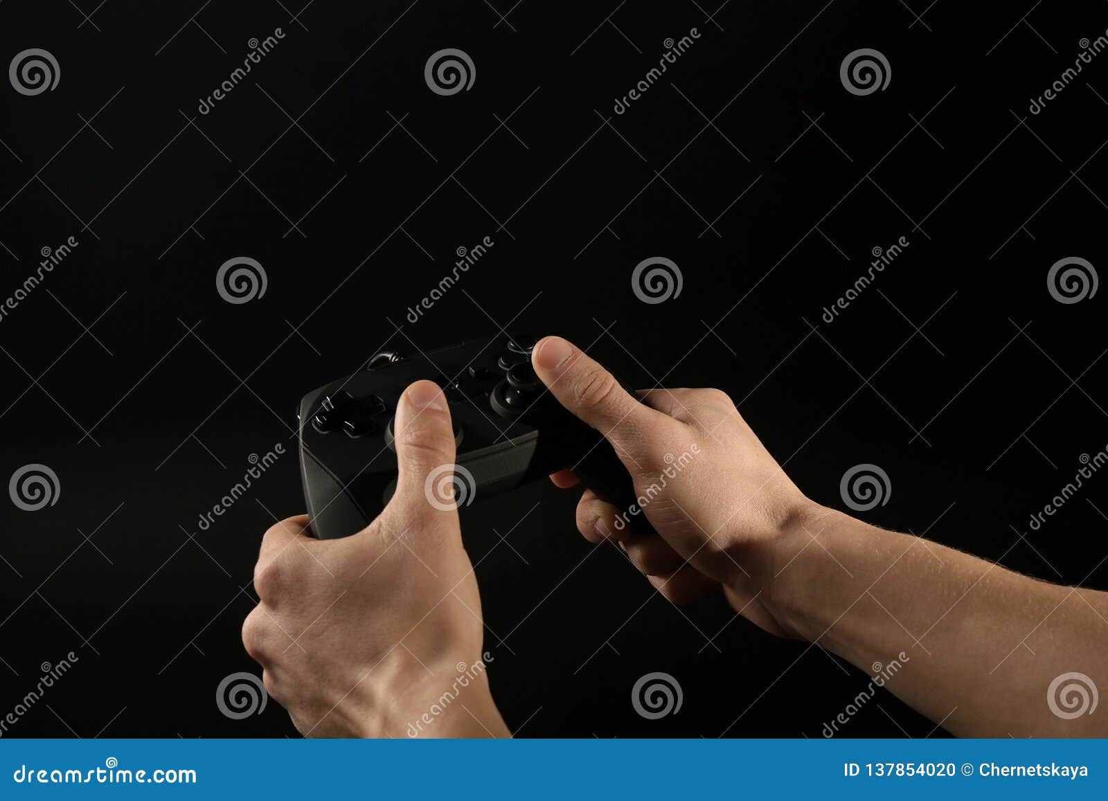 Man Holding Video Game Controller on Black, Closeup Stock Photo - Image ...