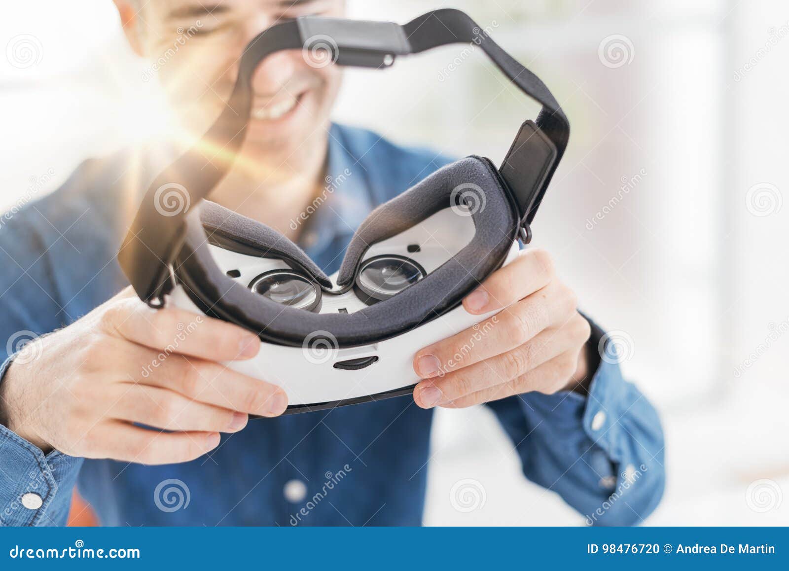 Man holding a VR viewer stock photo. Image of interactive - 98476720
