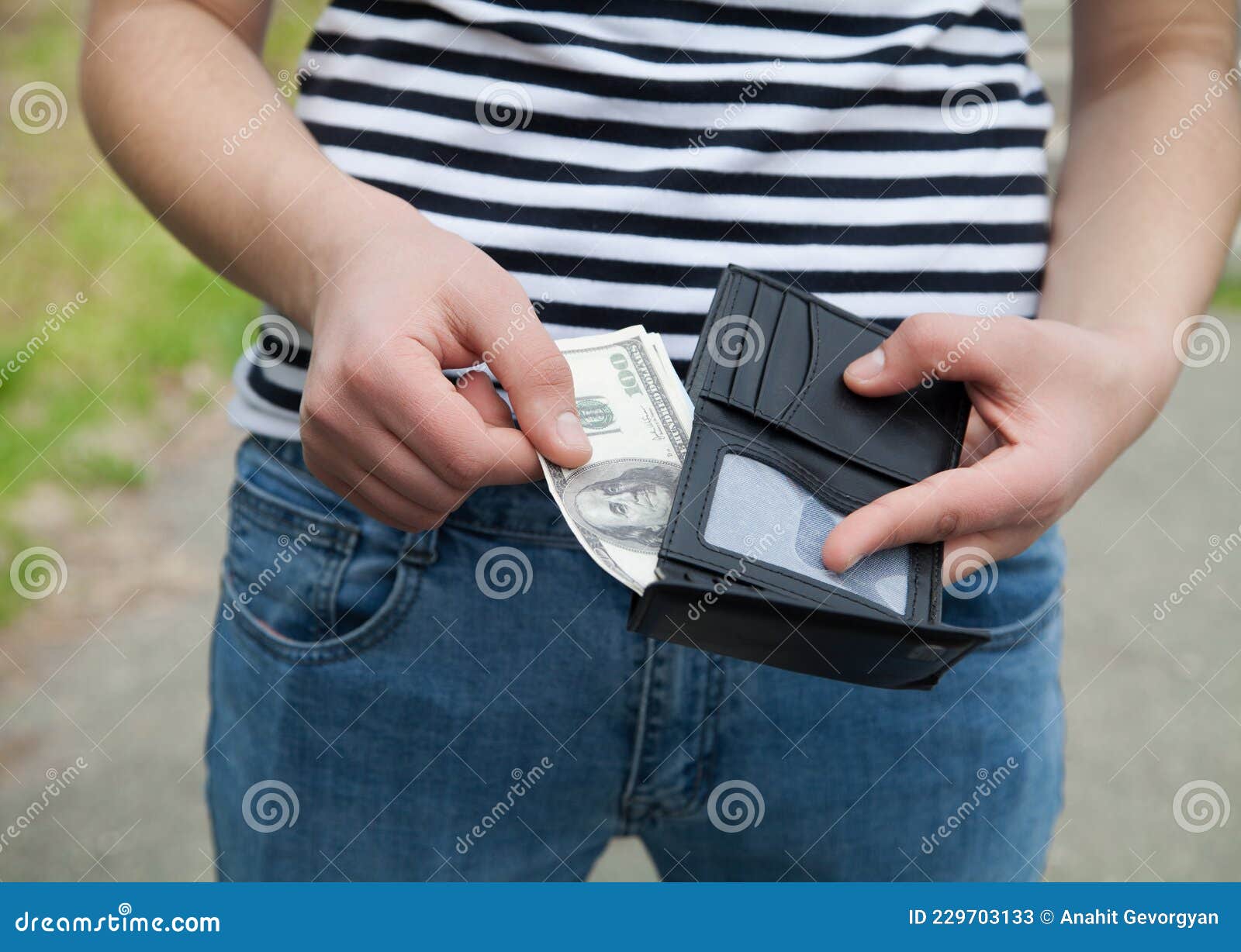 Man Holding Wallet in Dollars. Outdoor Stock Image - Image of green ...