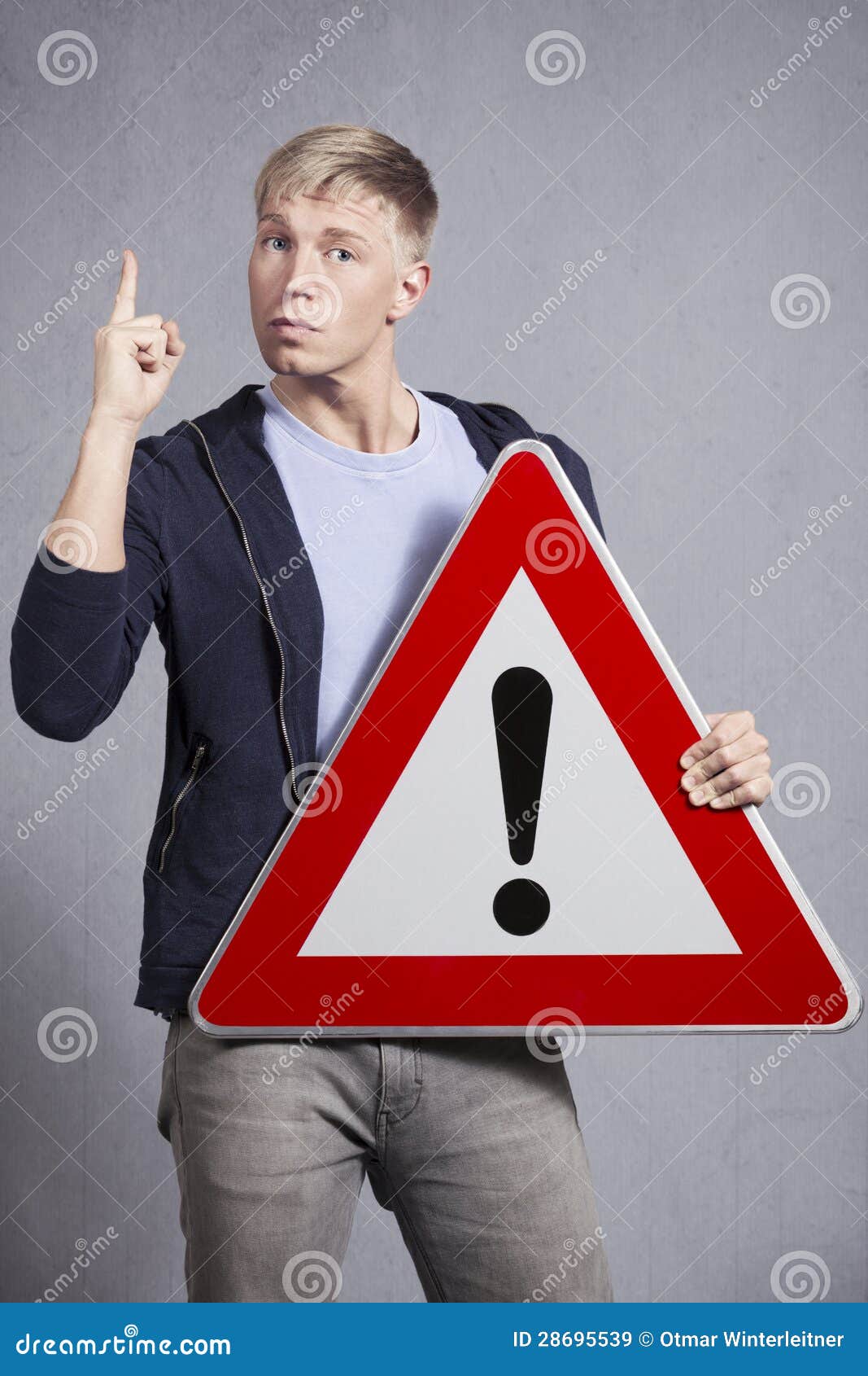 Man Holding Warning Sign with Exclamation Mark. Stock Image - Image of ...