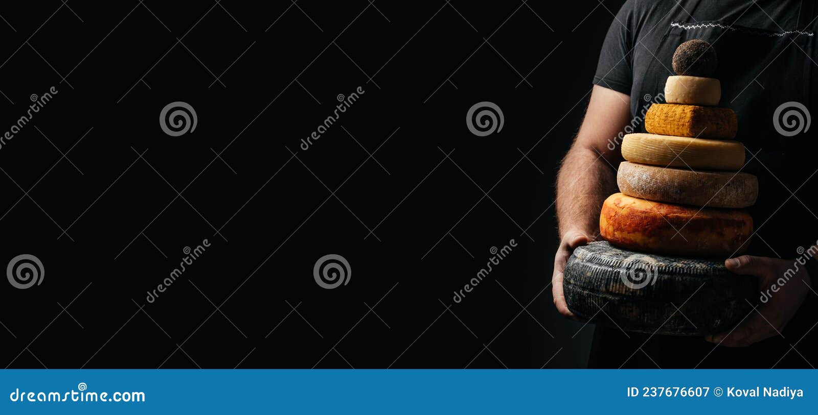 Man Holding a Wheels of Hard Cheese in His Hands. Cheesemaker on Dark ...