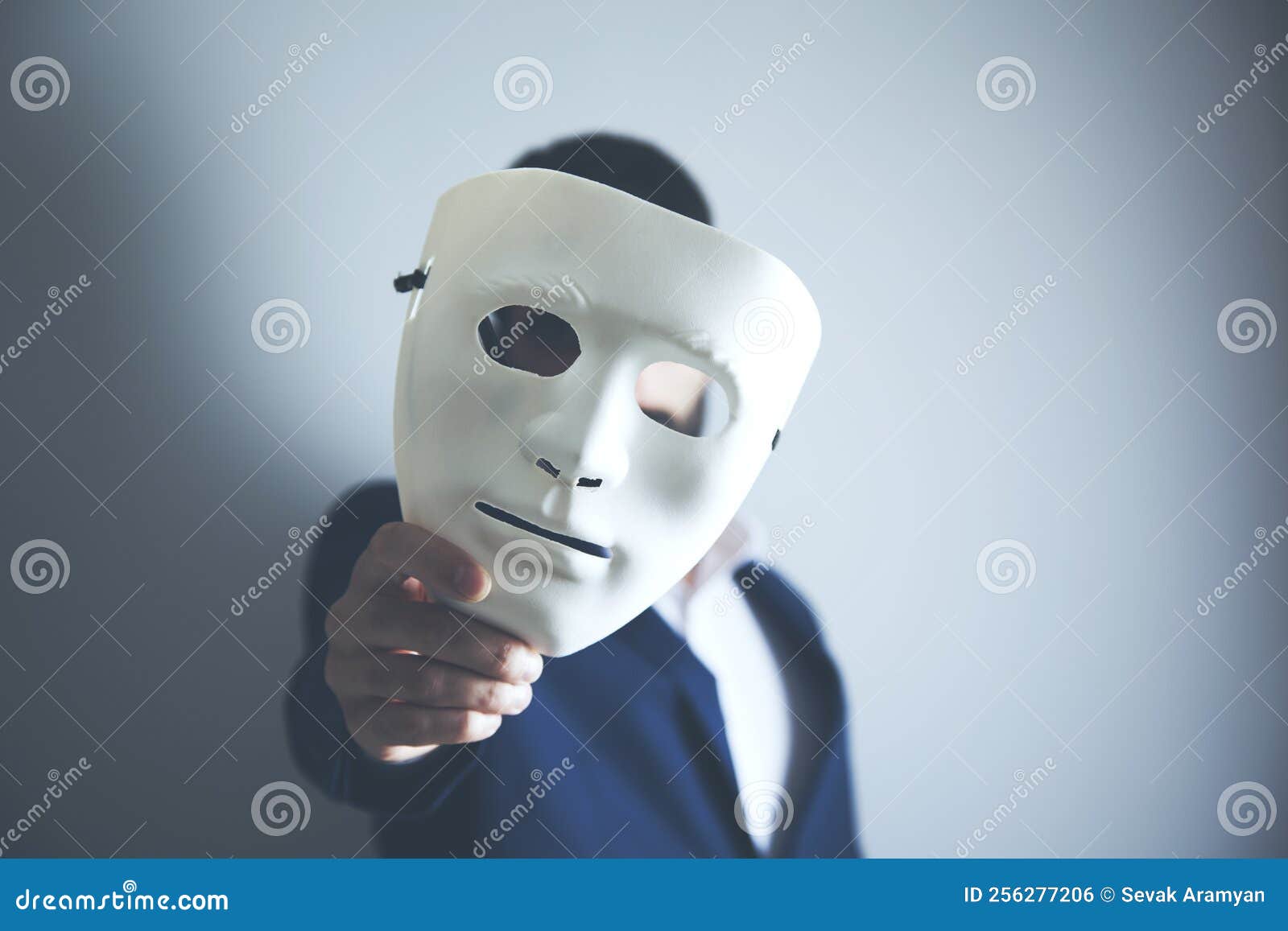 Man Holding White Mask for Hide His Face Stock Photo - Image of studio ...
