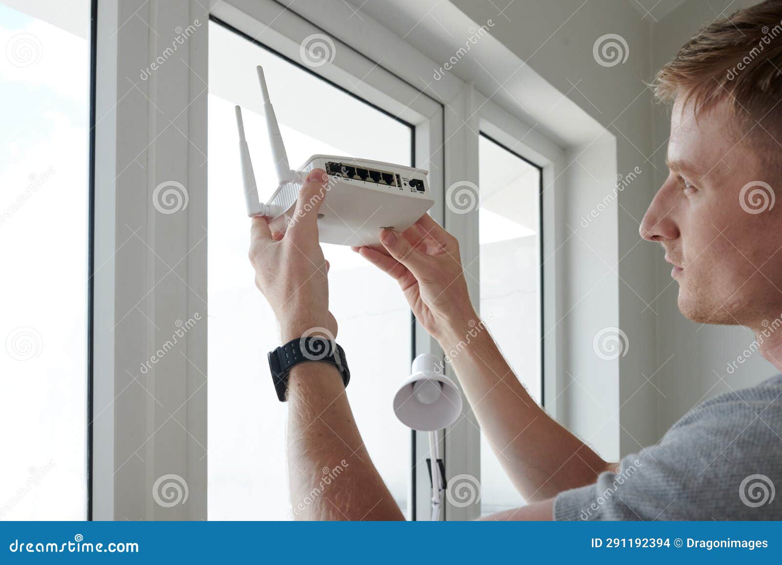 Man Holding Wi-Fi Router stock photo. Image of connection - 291192394