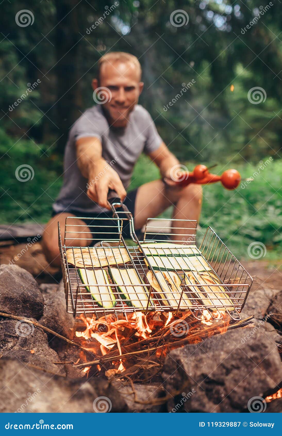 Man Holds Above Fire Grilling with Sliced Vegetables. Summer Pic Stock ... Man Holds Above Fire Grilling with Sliced Vegetables. Summer Pic Stock ...