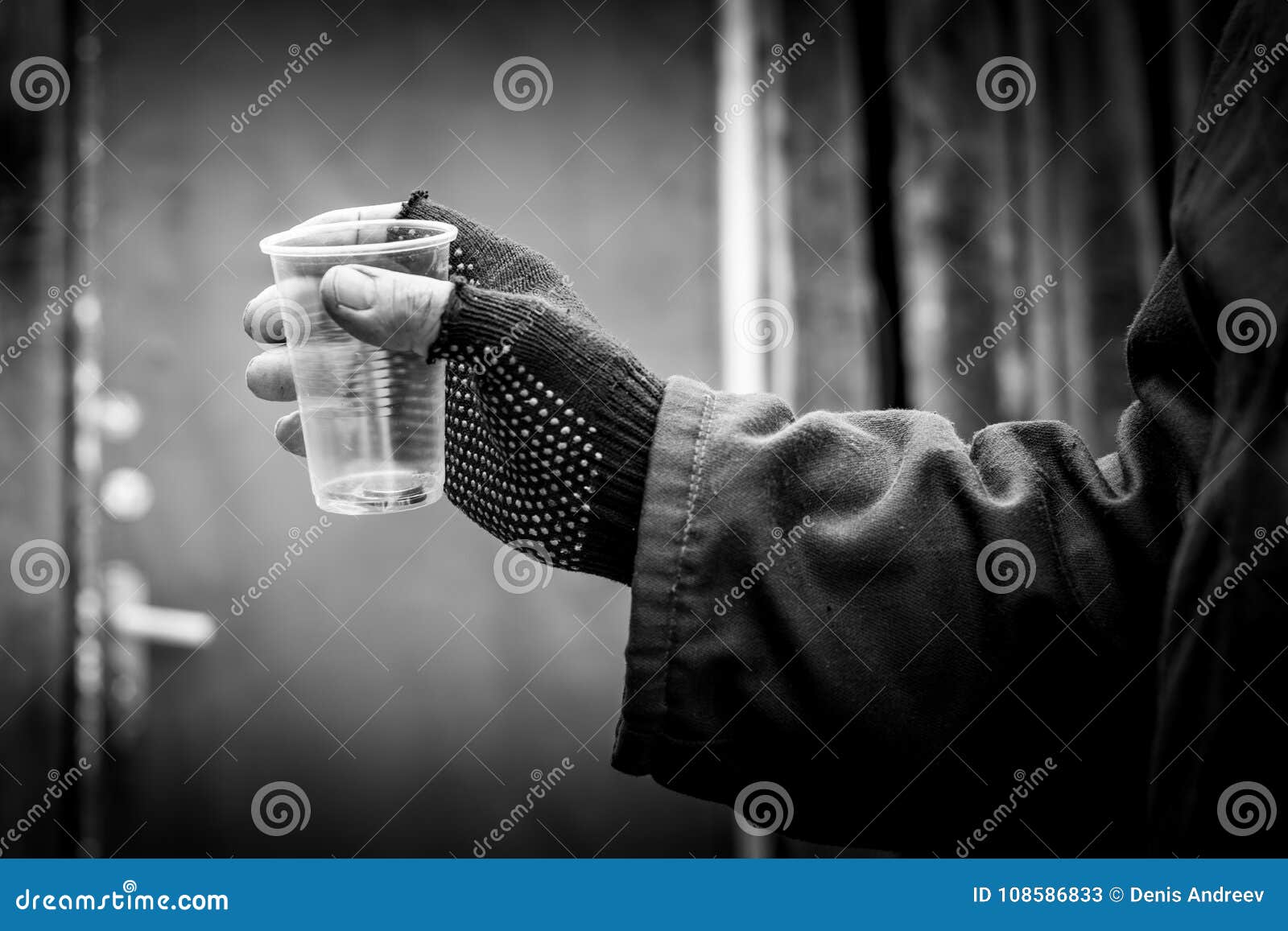 A Man Holds a Cup in an Outstretched Hand. Stock Image - Image of ...