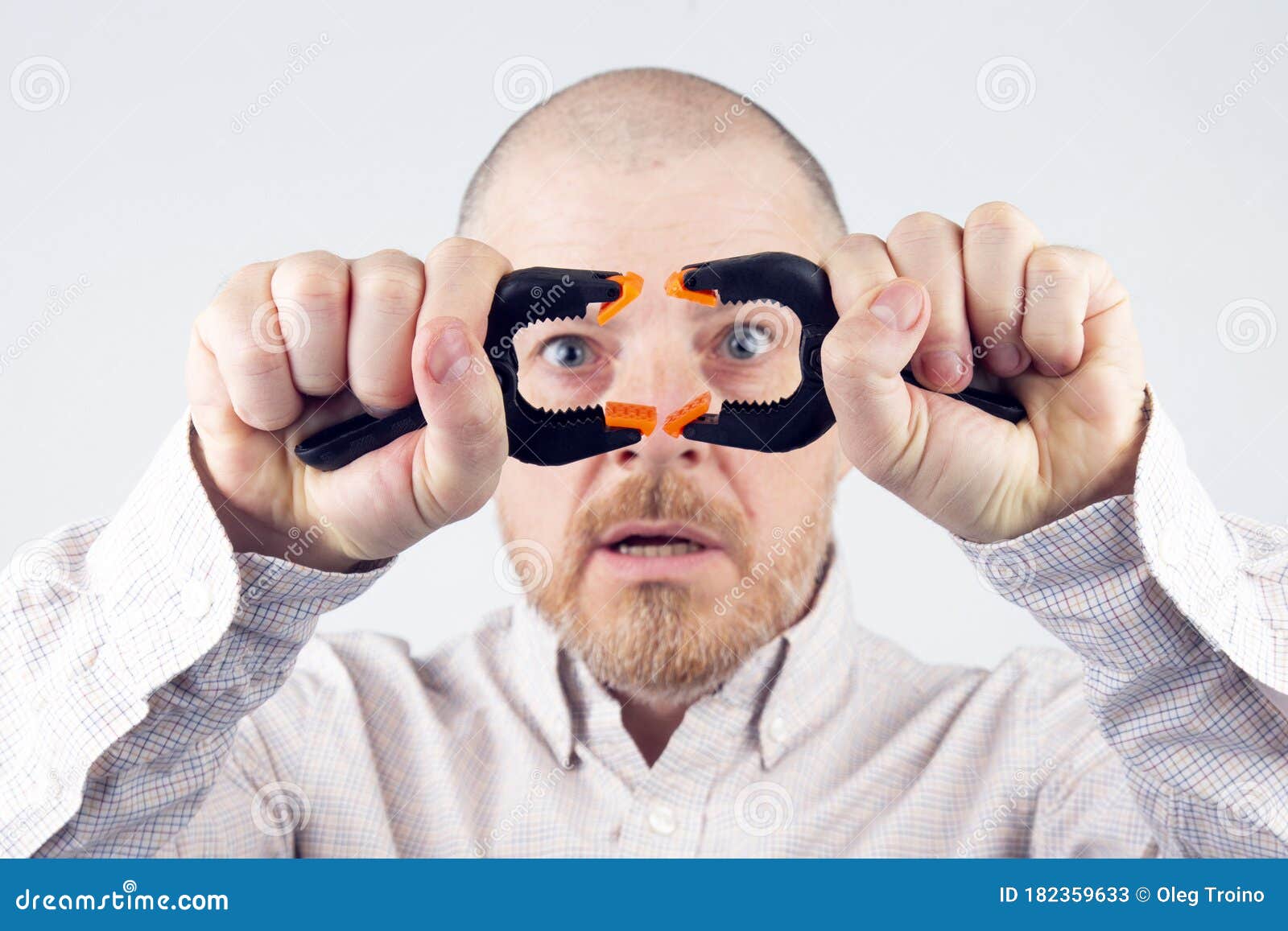 Man Holds in the Hands of Industrial Clamps Stock Image - Image of ...