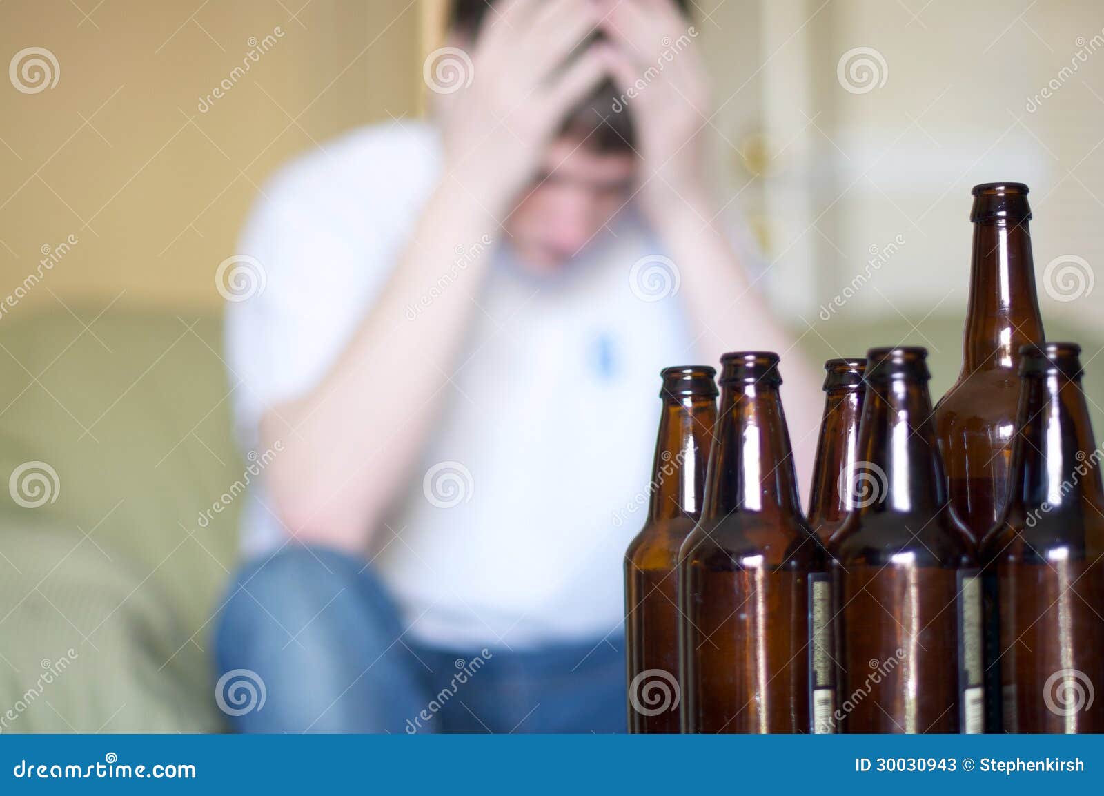 Man Holds Head with Group of Empty Beer Bottles Stock Image - Image of ...