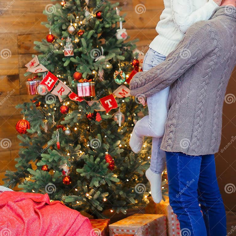 A Man Holds His Girlfriend In His Arms And Raises Her Next To Ch Stock