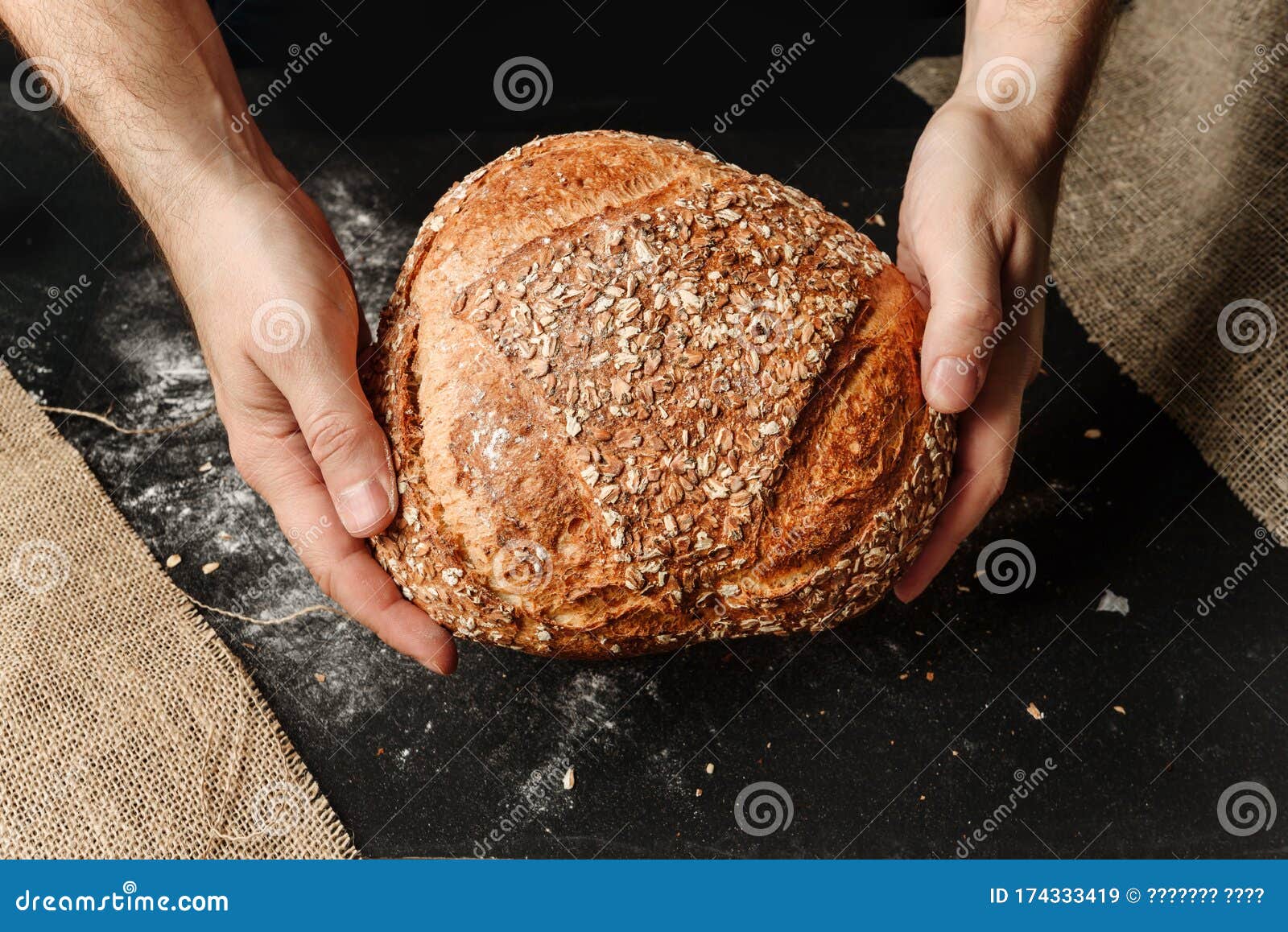 A Man Holds in His Hands a Loaf of Rustic Organic Bread Stock Image ...
