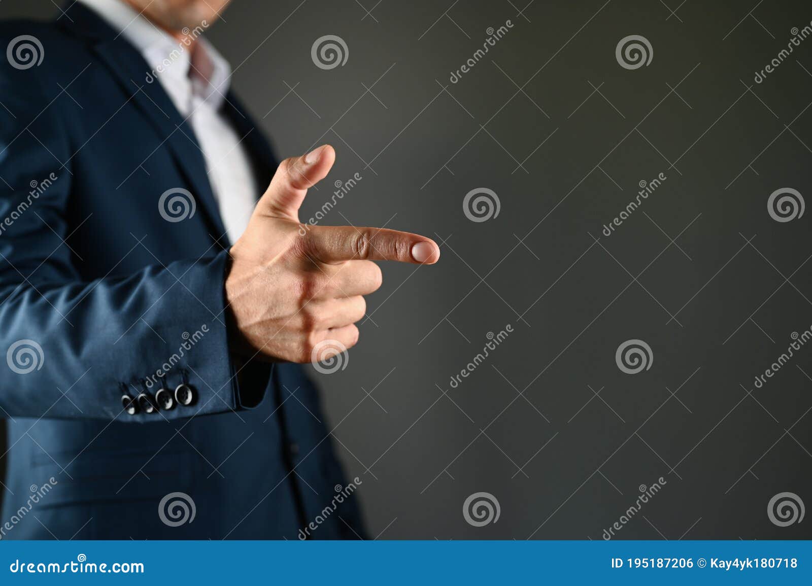 The Man Holds His Index Finger In Front Of Him. A Man In A Suit Points ...