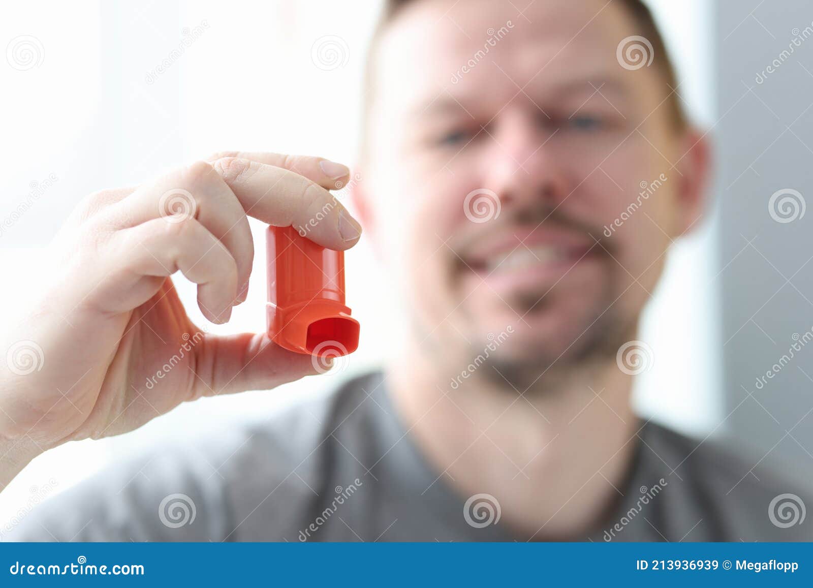 Man Holds an Inhaler in His Hand. Stock Image - Image of hold ...