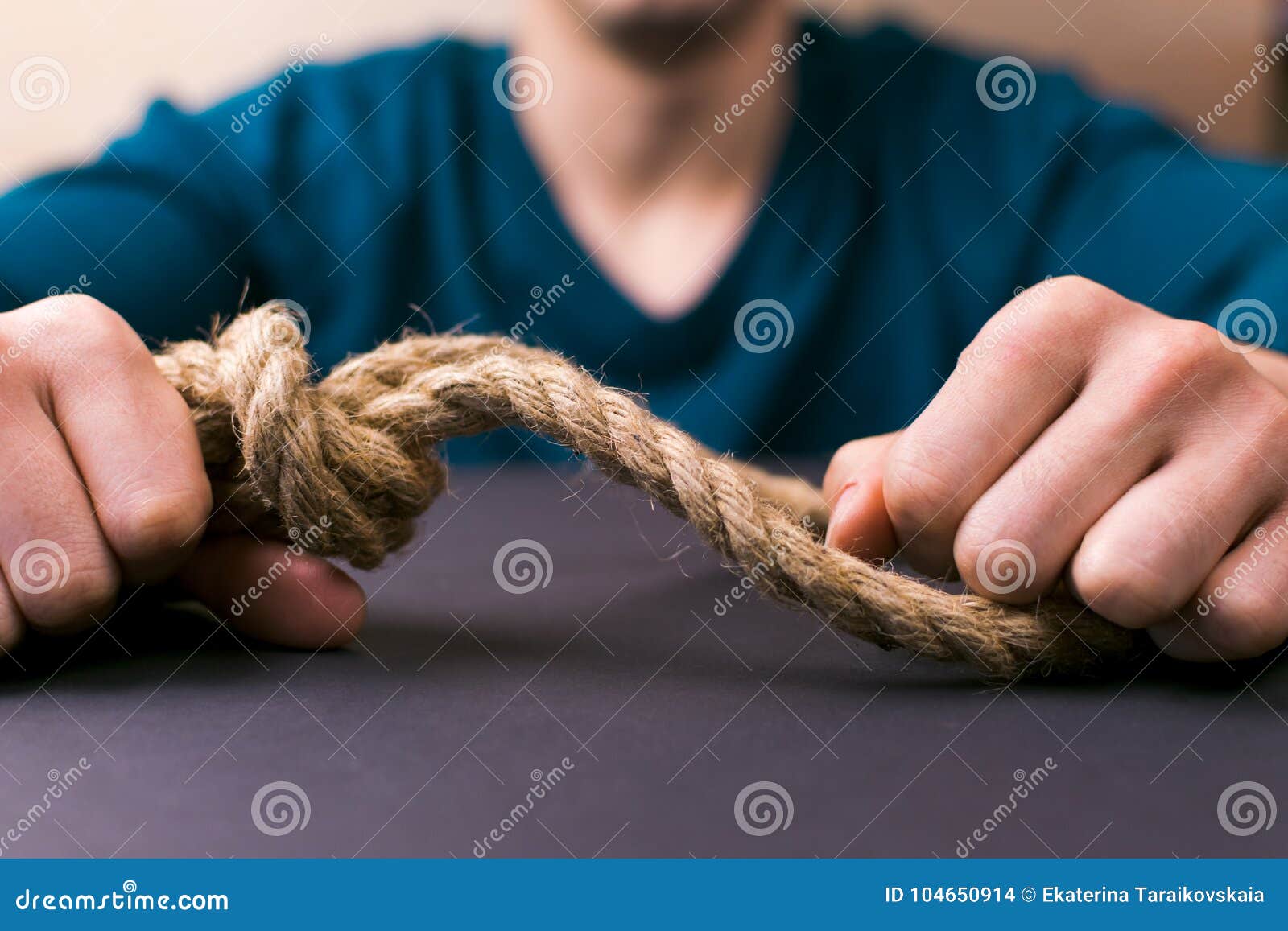 A Man Holds a Loop of Rope in His Hands. a Mental Health Day. Stock ...