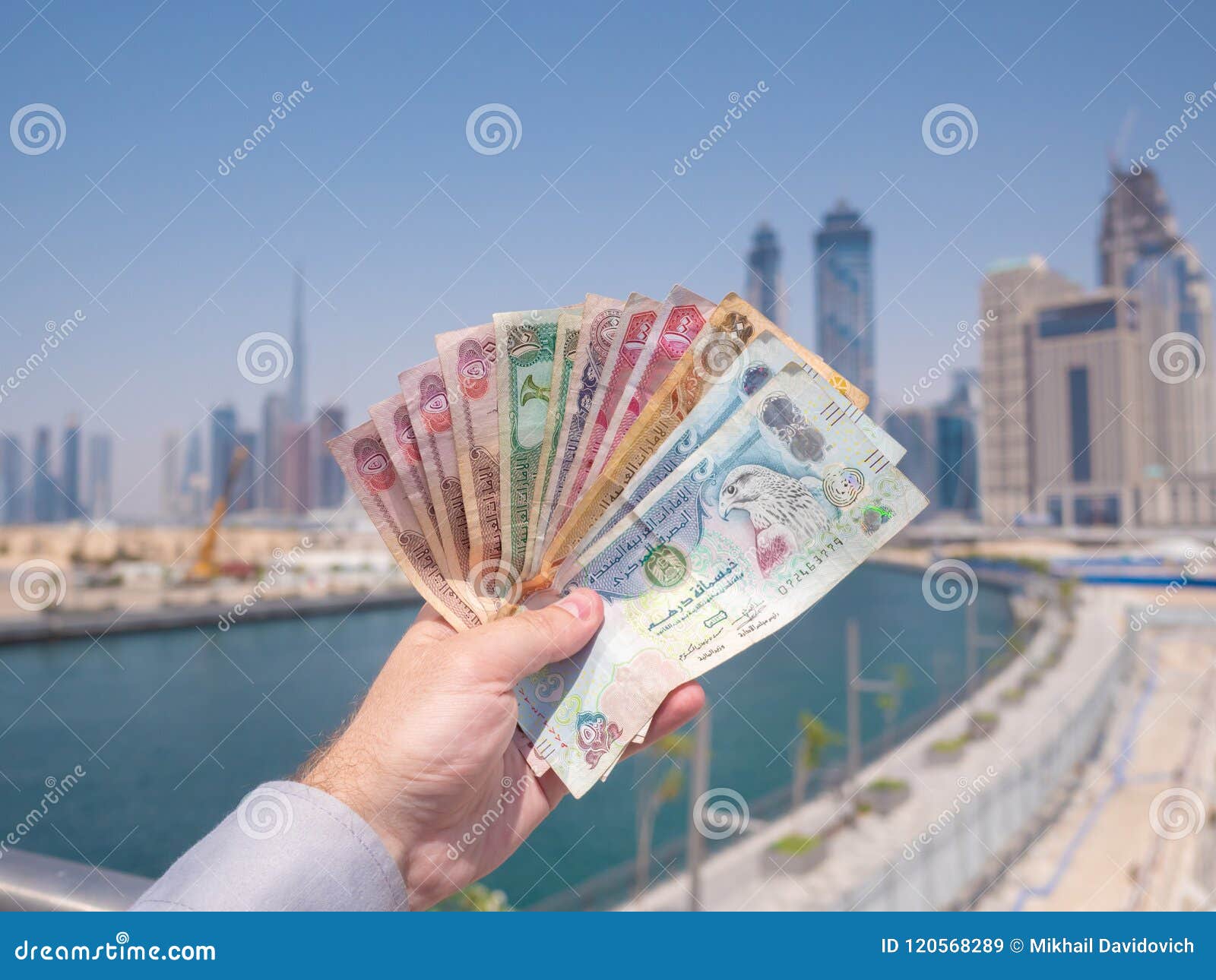 A Man Holds the Money of the United Arab Emirates. Dirham. Stock Image ...