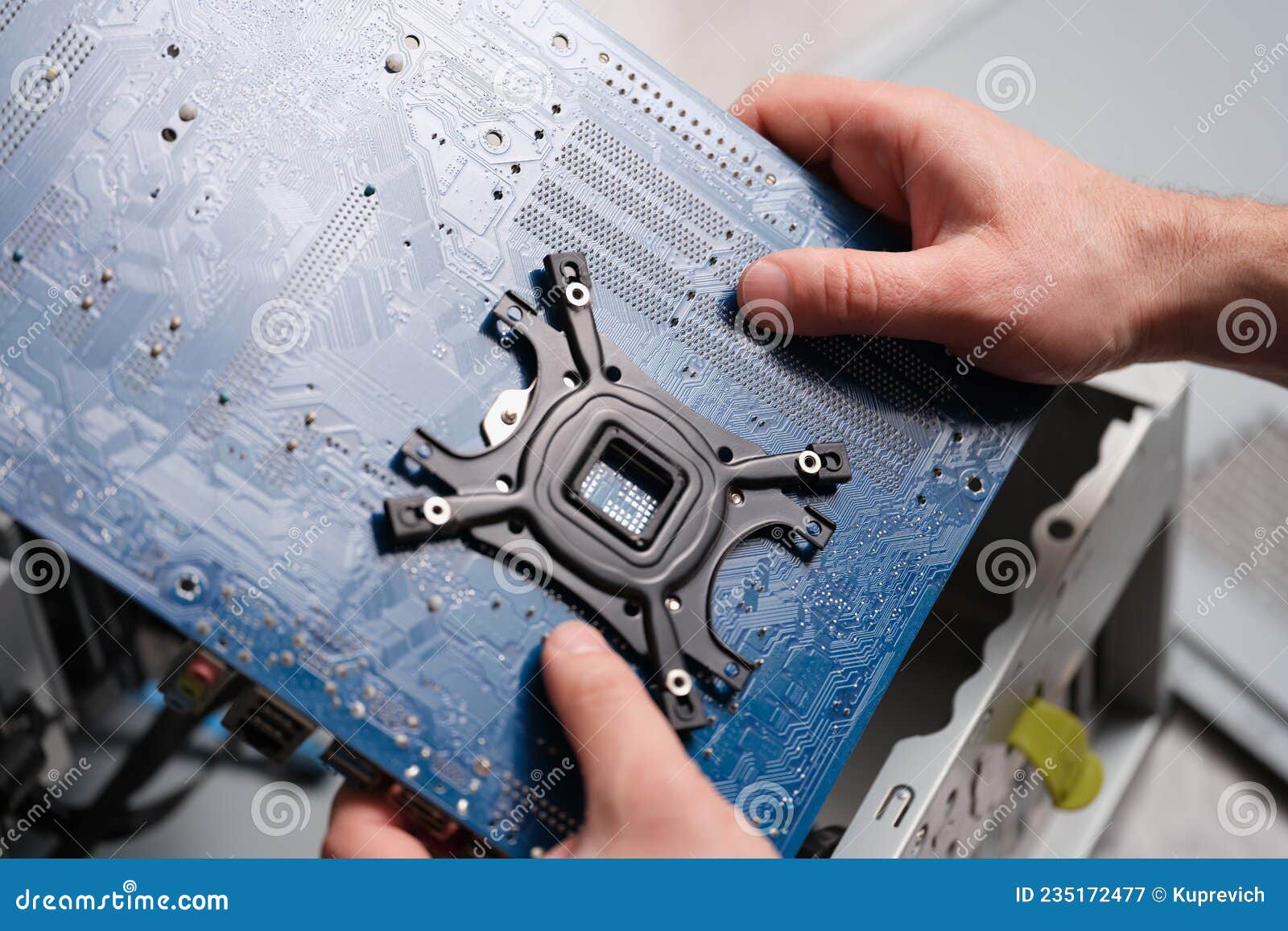 A Man Holds a Motherboard Over a Pc, Close-up Stock Image - Image of ...