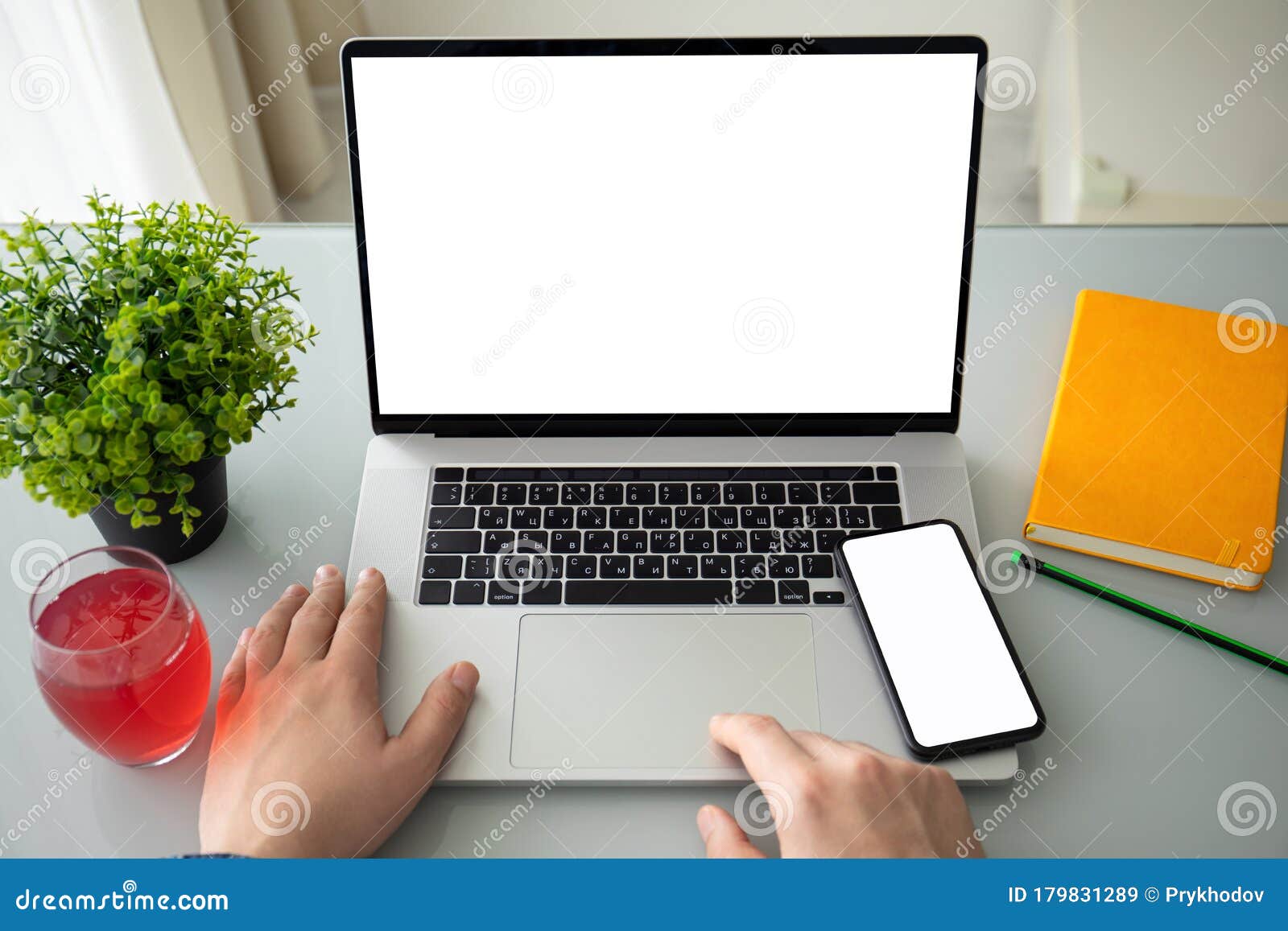 Man Holds Phone Over Laptop Computer with Isolated Screen Stock Image ...