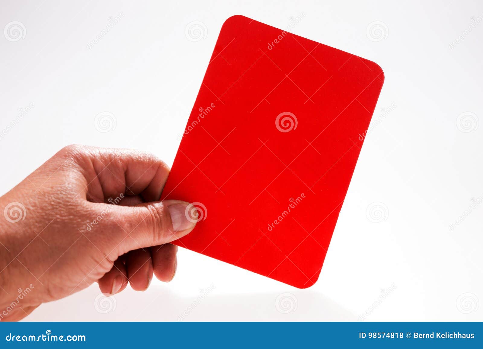 Man holds red card in hand stock photo. Image of soccer - 98574818