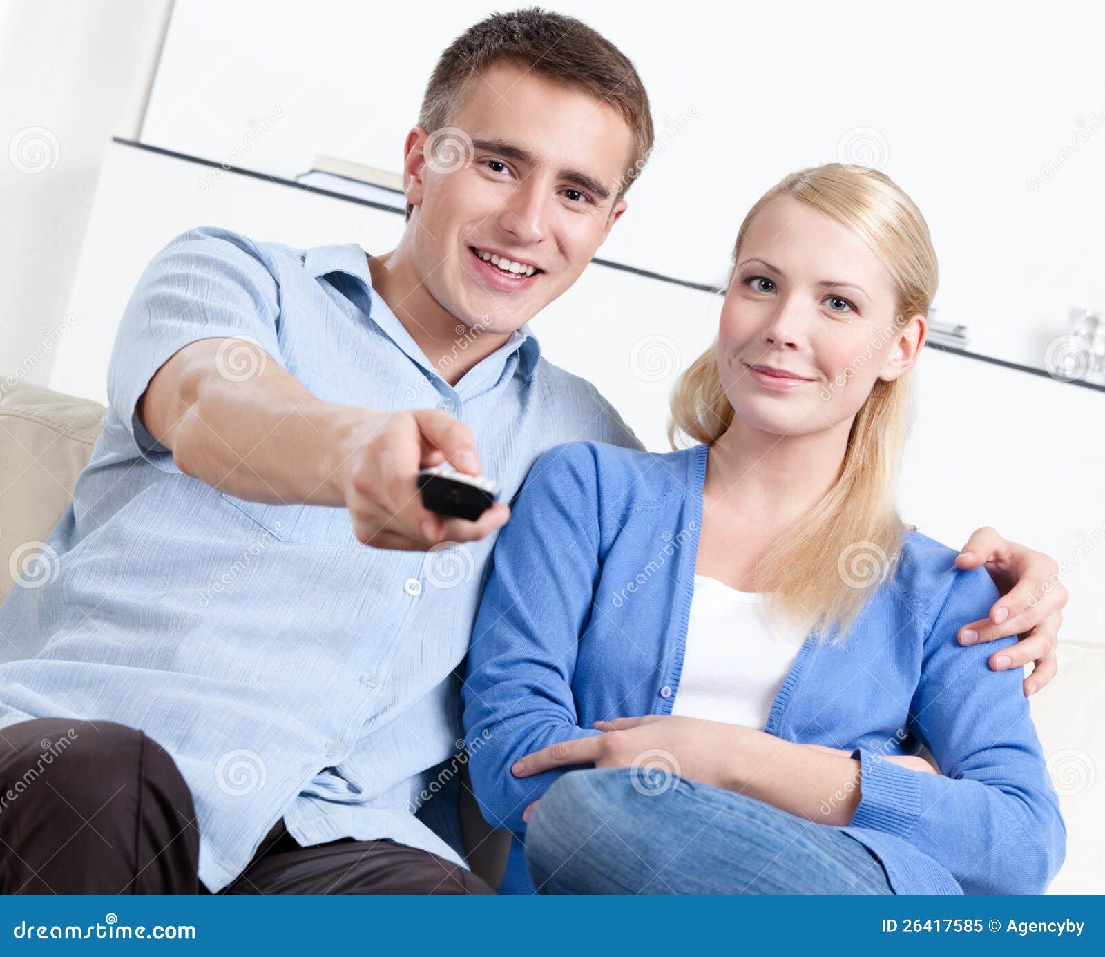 Man holds remote control stock image. Image of cute, adult - 26417585