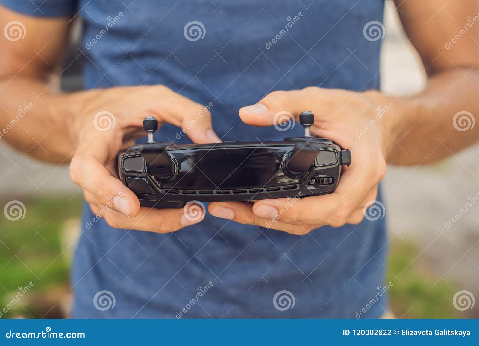 Man Holds Remote Controller with His Hands and Controls the Drone. New ...
