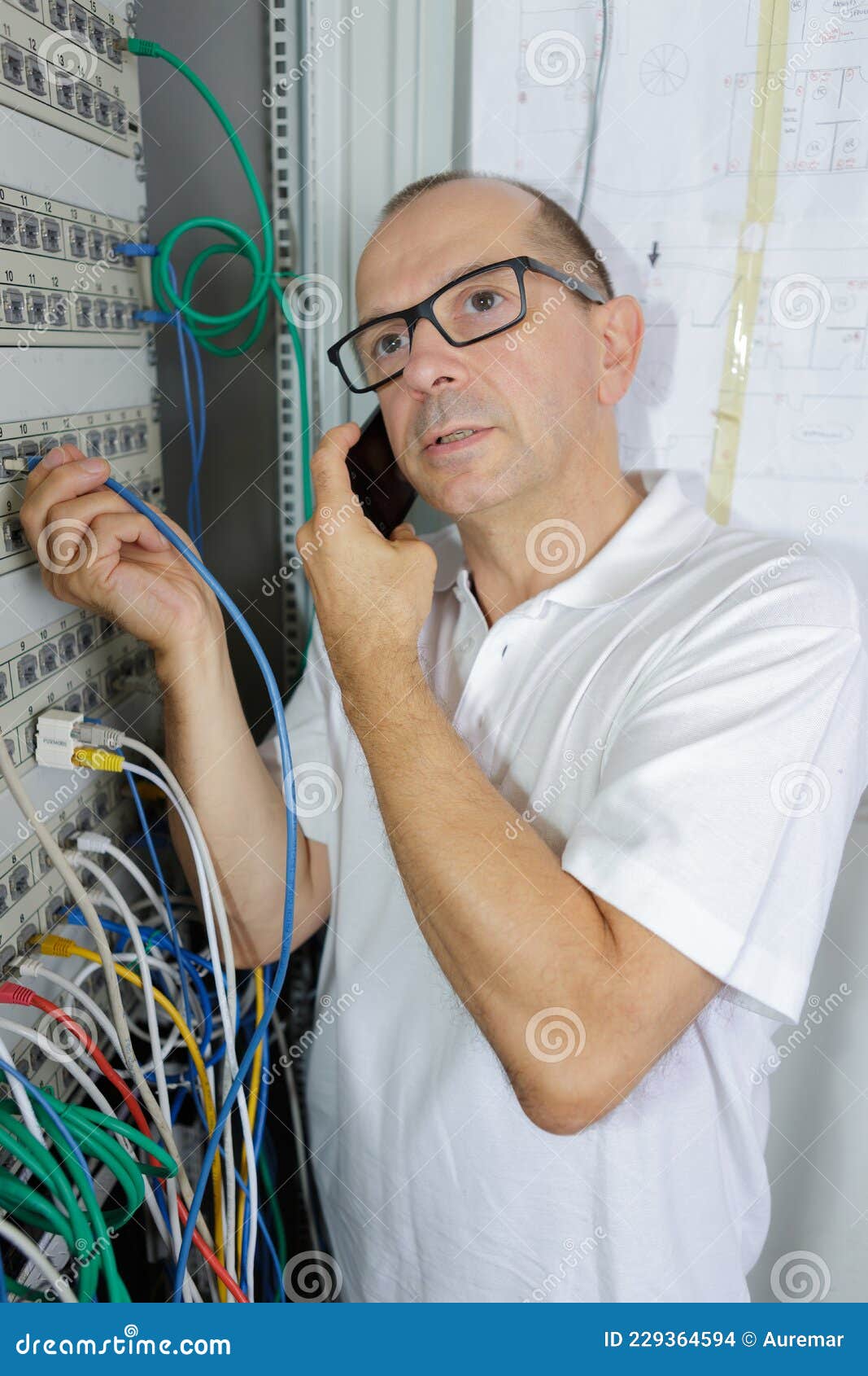 Man Holds Server Cable in Server Rack Stock Photo - Image of data ...