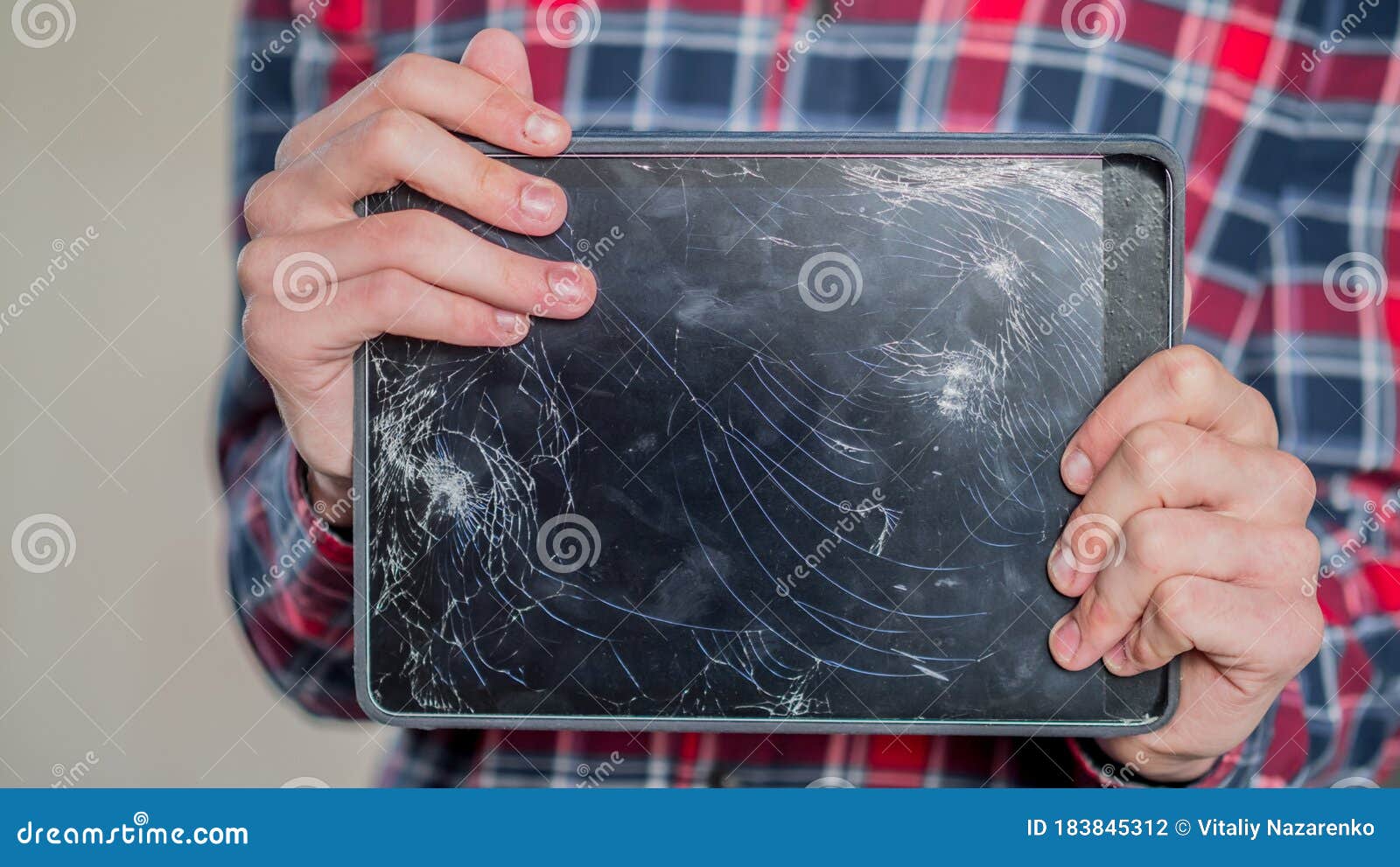 A Man Holds a Tablet with a Broken Screen Stock Photo - Image of broken ...