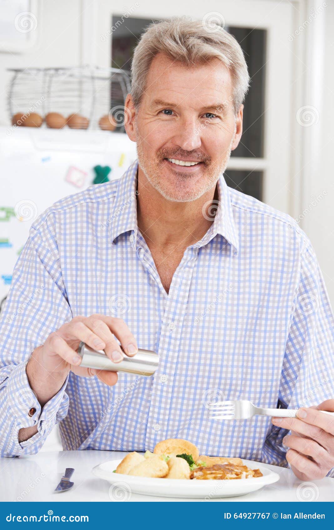 Man at Home Adding Salt To Meal Stock Image - Image of condiment ...