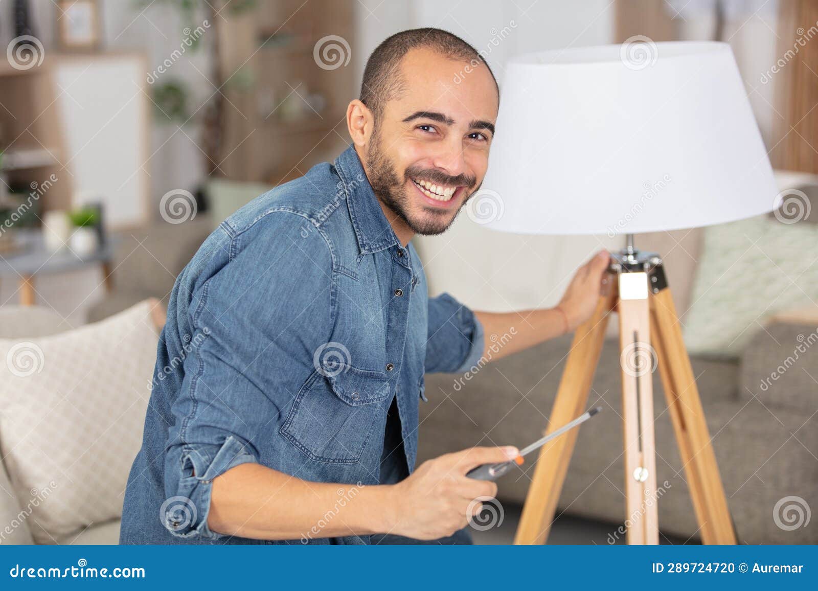 Man at Home Assembling New Lamp with Screwdriver Stock Photo - Image of ...