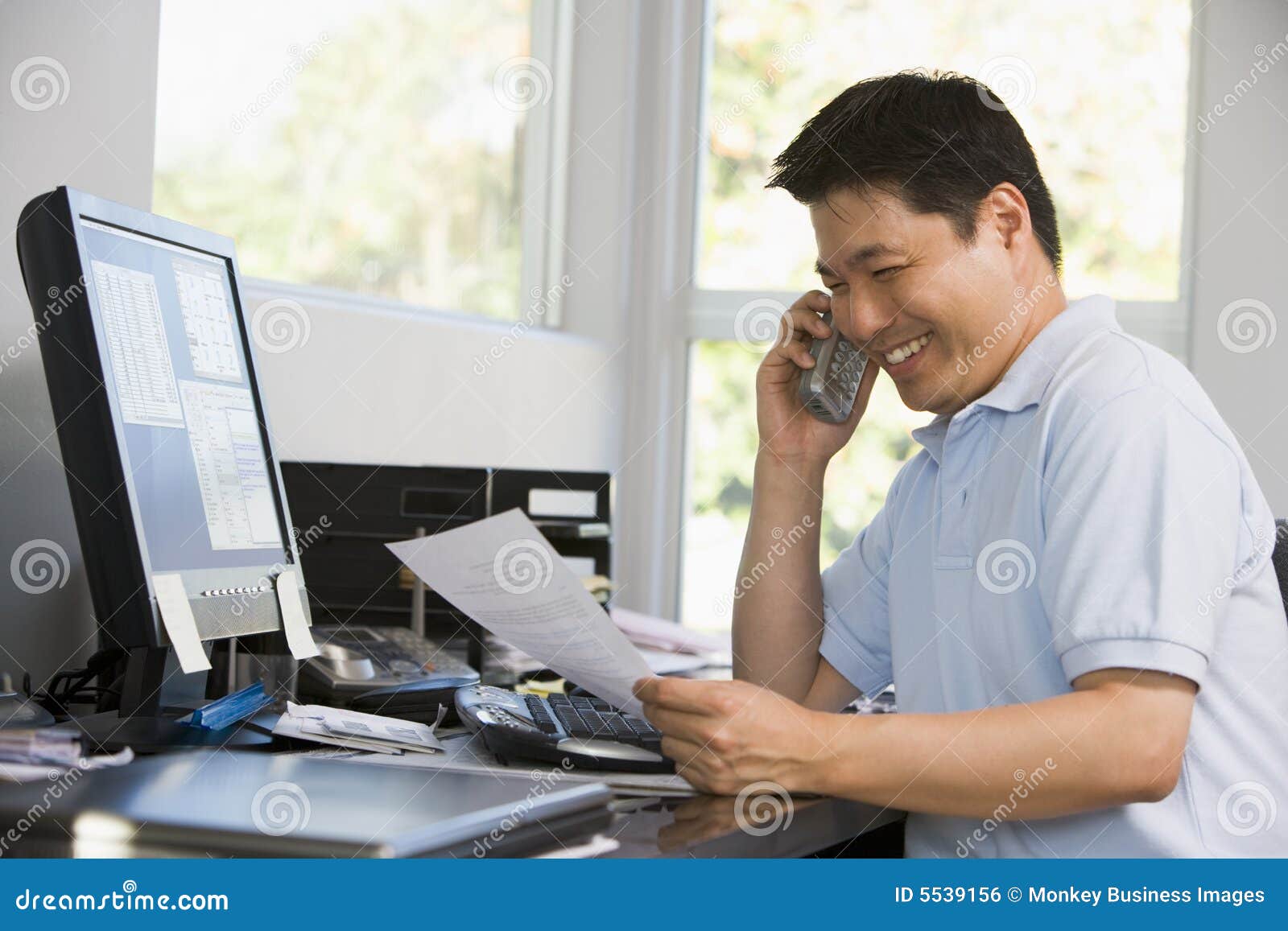 Man in Home Office with Computer and Paperwork Stock Photo - Image of ...