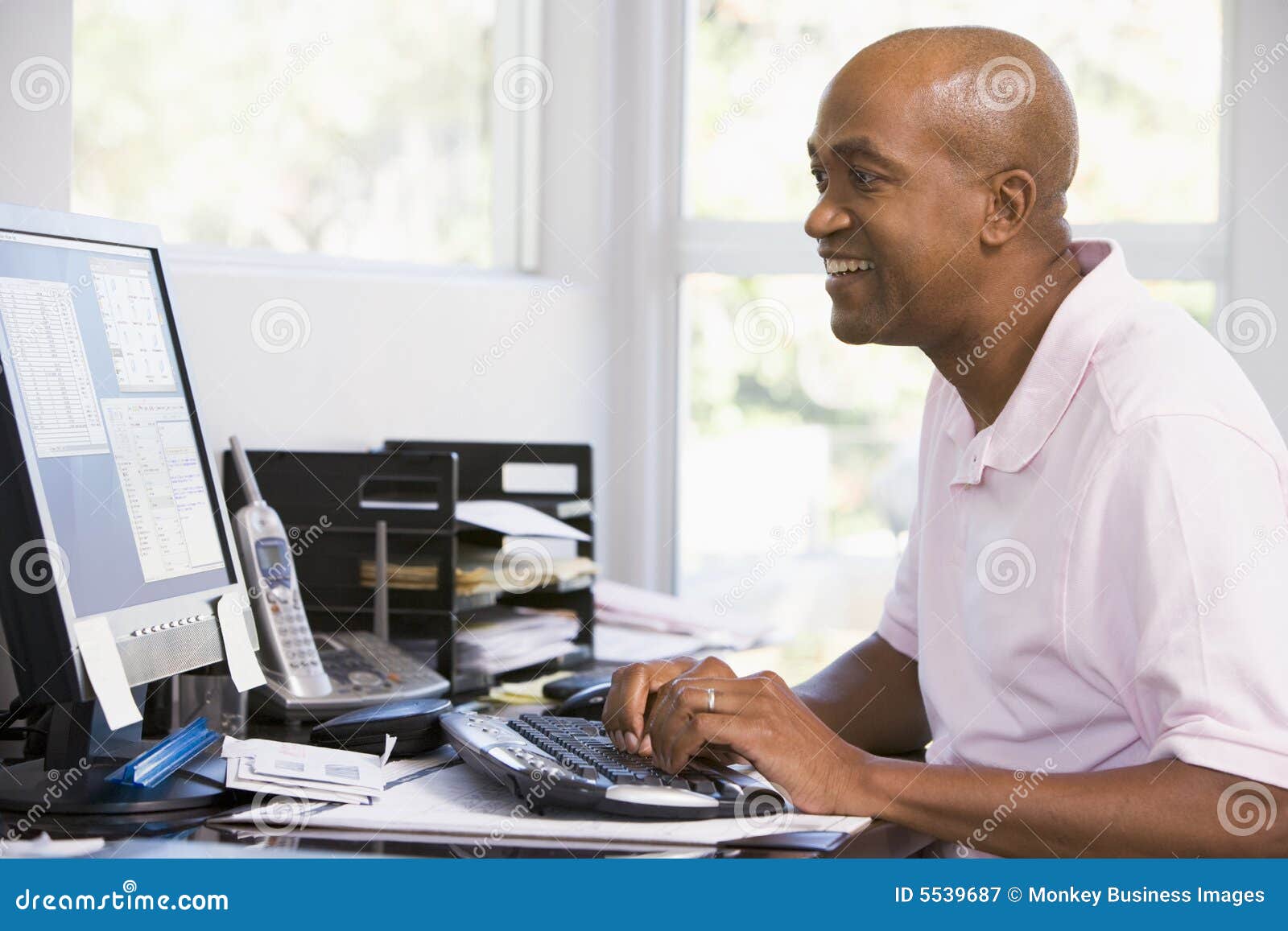 Man in Home Office Using Computer and Smiling Stock Image - Image of ...