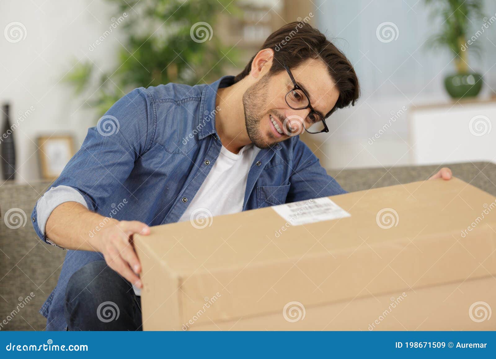 Man at Home Opening Cardboard Box Stock Image - Image of logistics ...