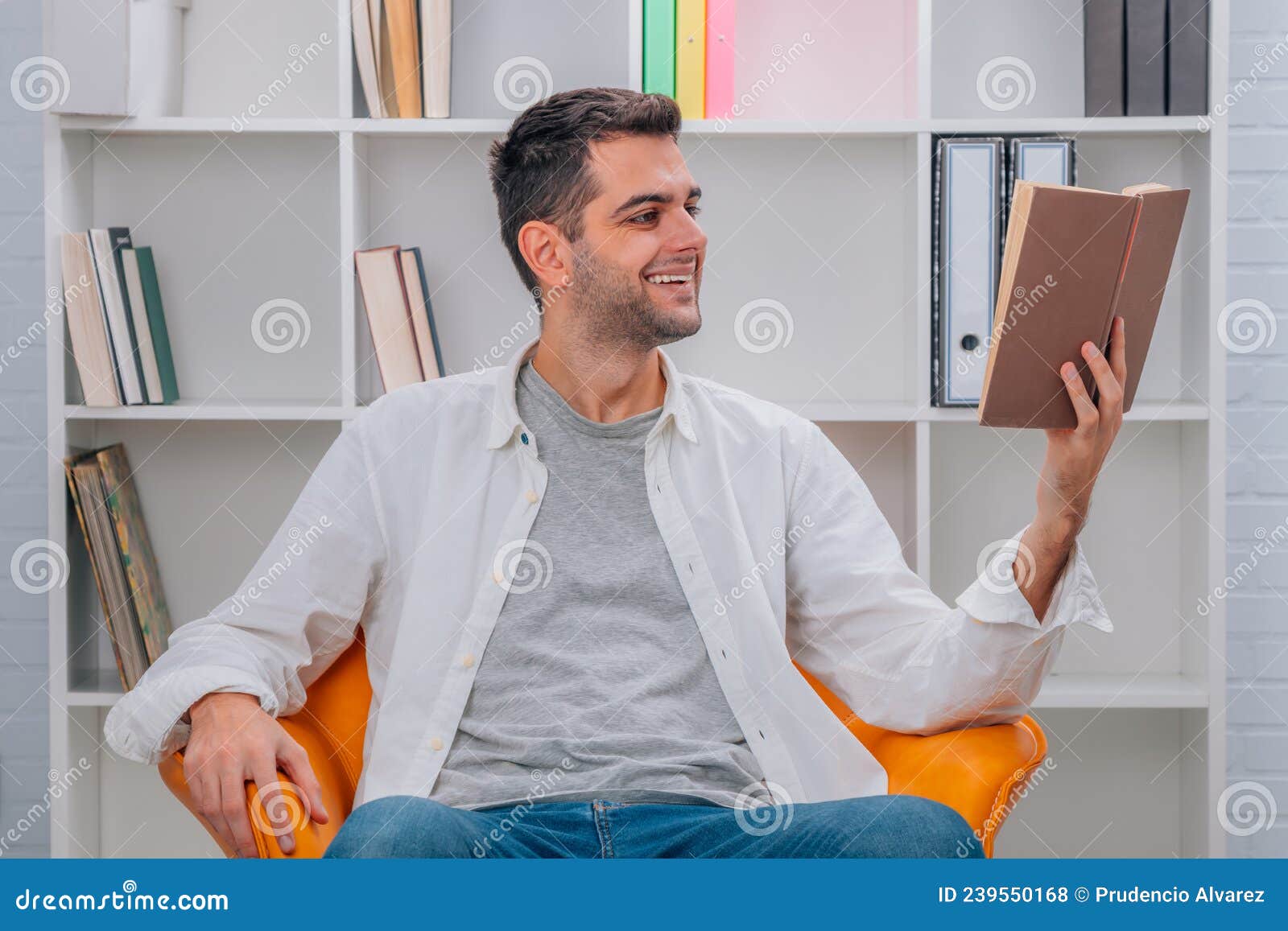 Happy Man at Home Reading a Textbook Stock Photo - Image of culture ...