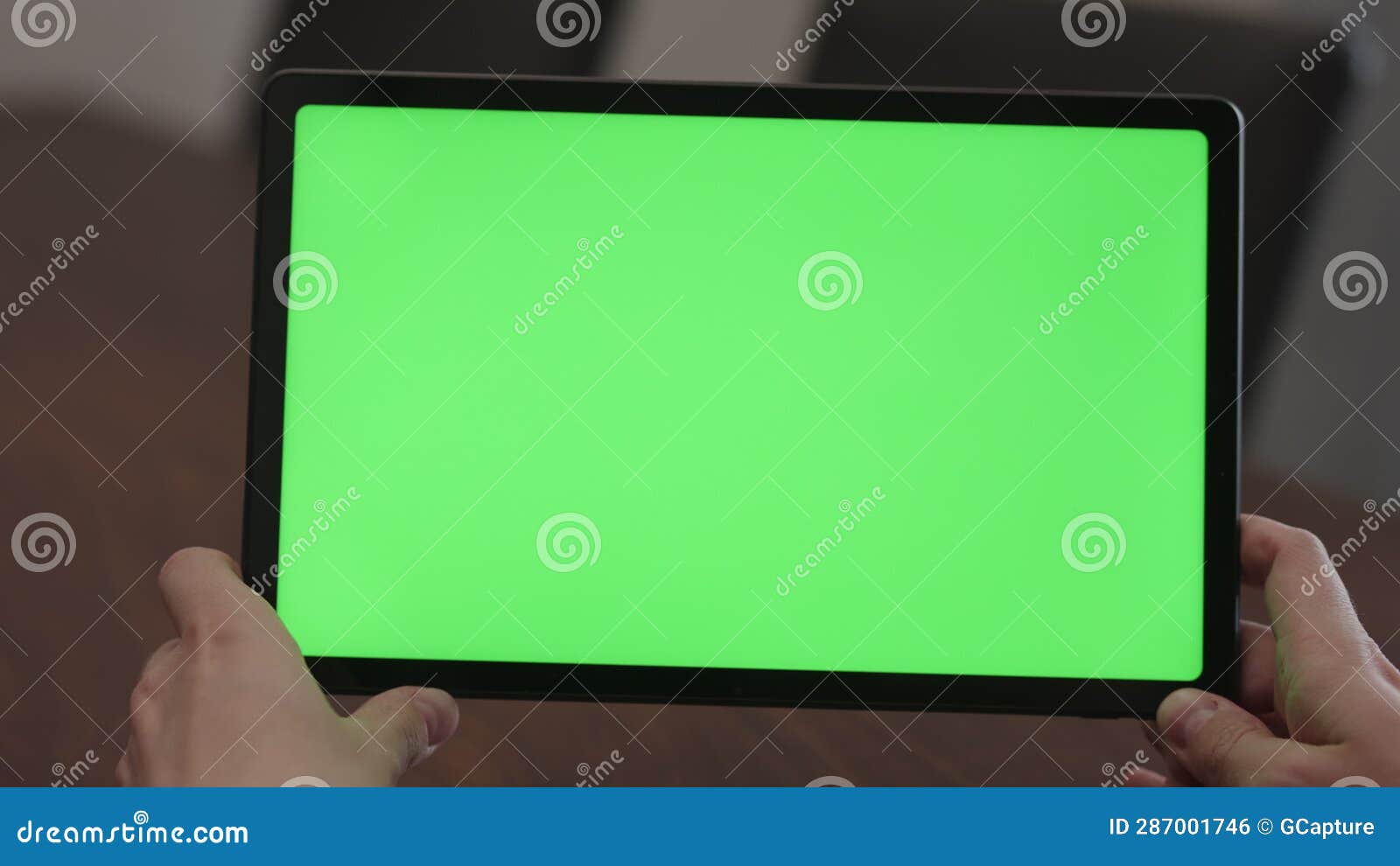 Man at Home Using Tablet Pc with Green Screen while Sitting at the ...