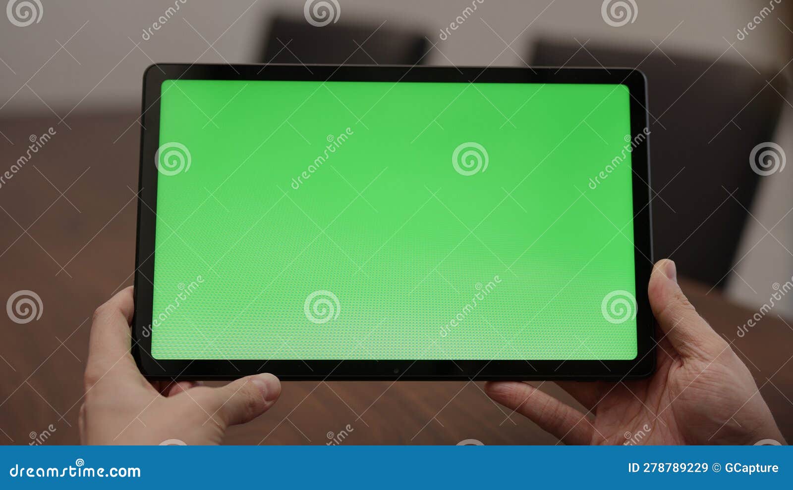 Man at Home Using Tablet Pc with Green Screen while Sitting at the ...