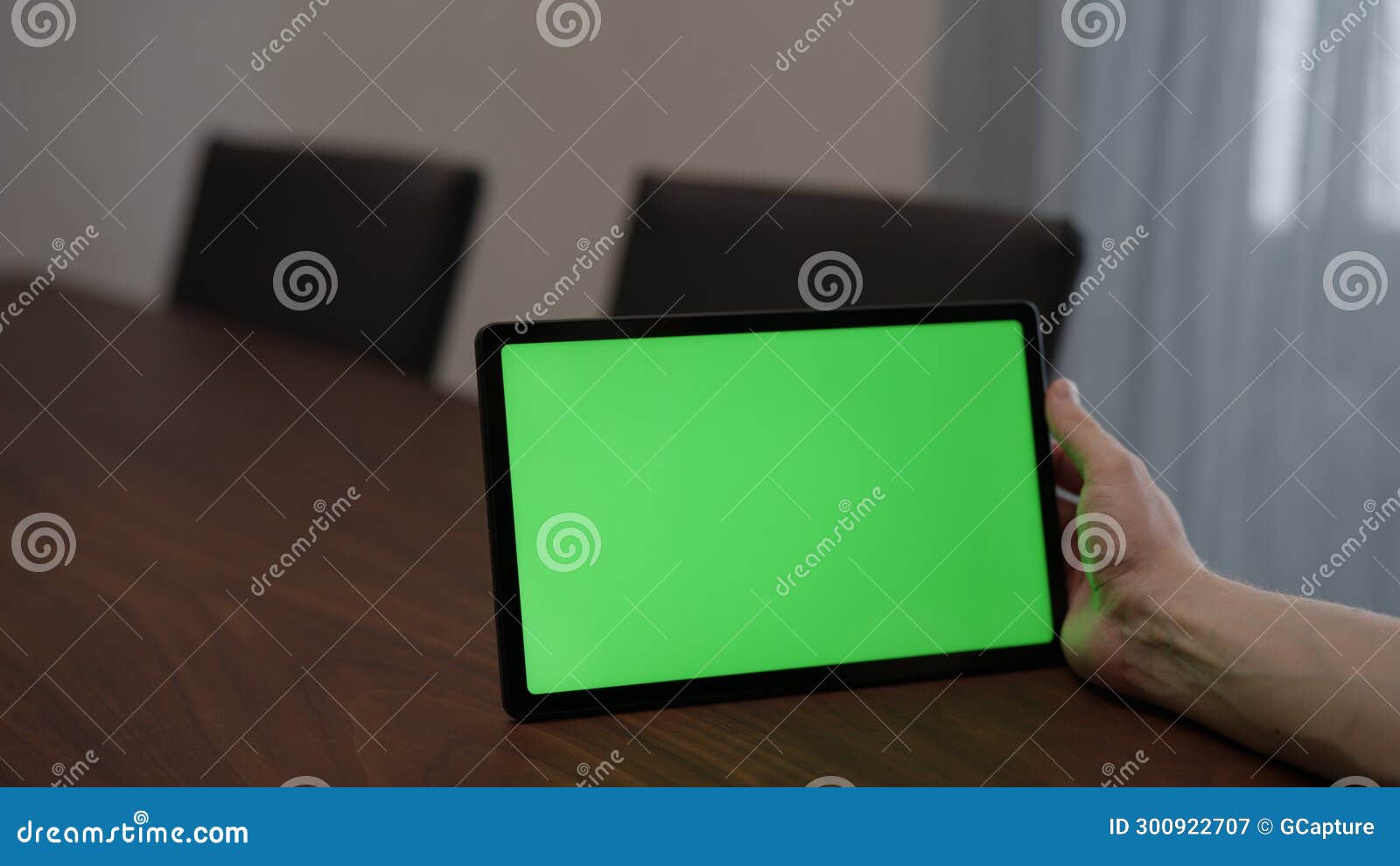 Man at Home Using Tablet Pc with Green Screen while Sitting at the ...