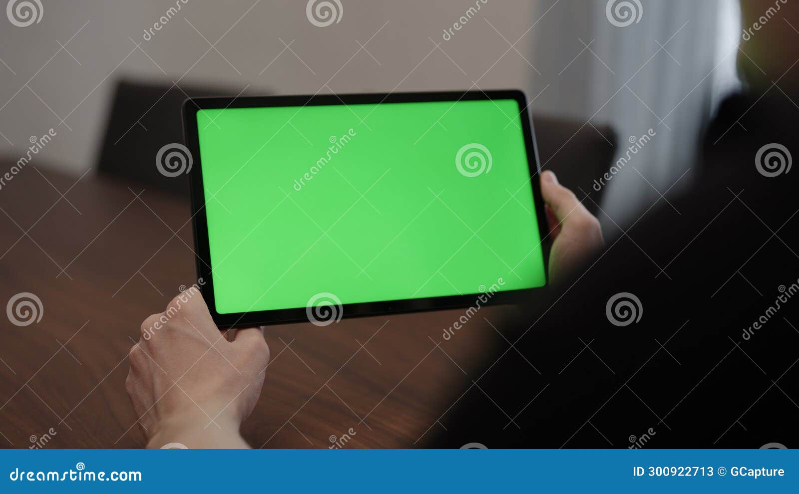 Man at Home Using Tablet Pc with Green Screen while Sitting at the ...