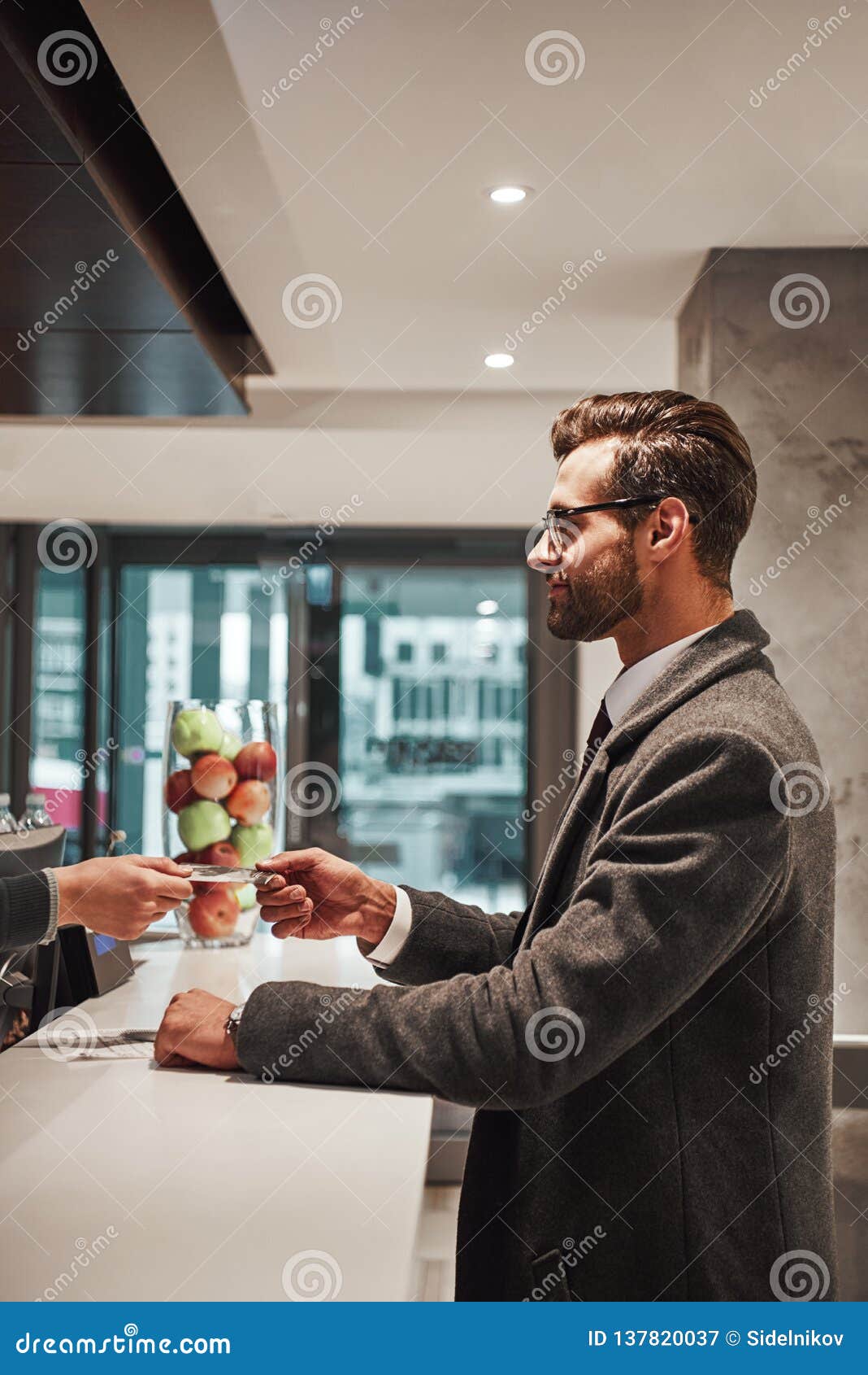 Man in Hotel Check in at Reception or Front Office Being Given Key Card ...