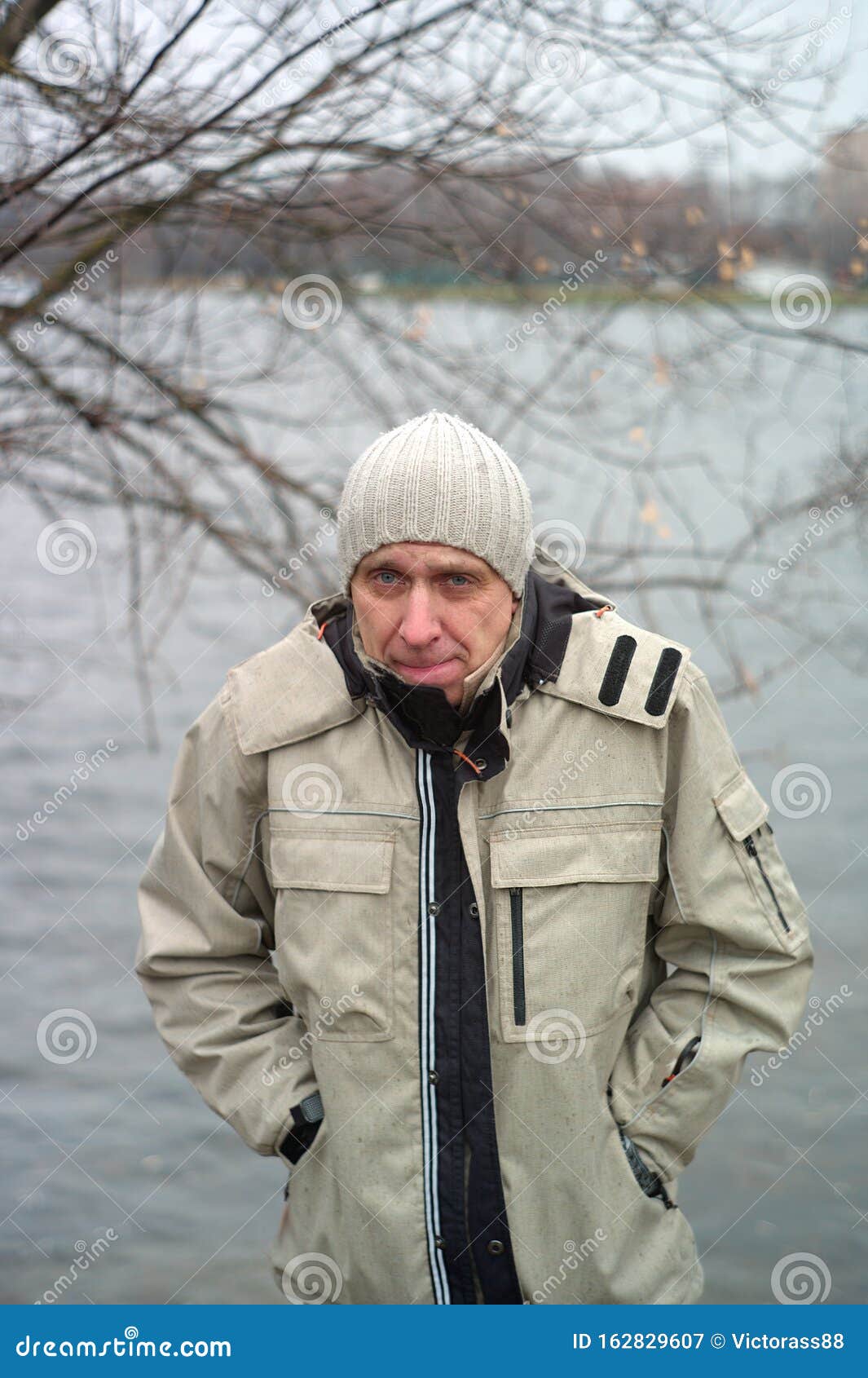 Man huddled from cold stock image. Image of mature, season - 162829607