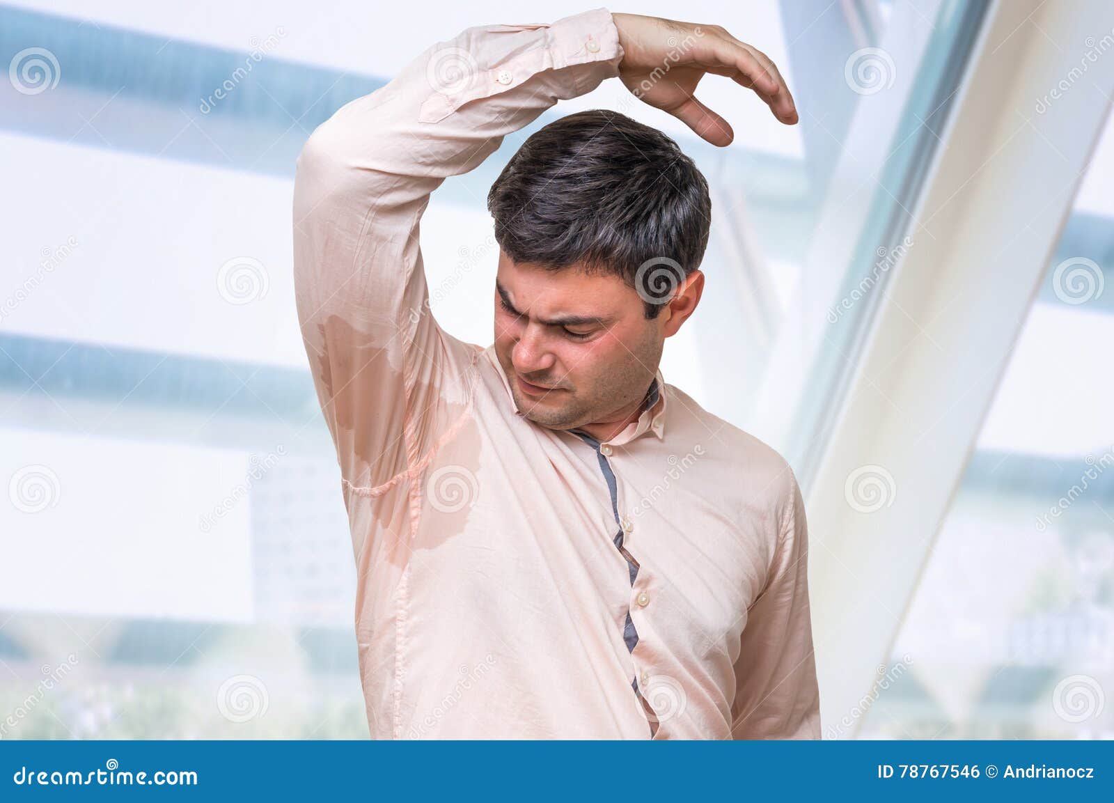 Man with Hyperhidrosis Sweating Under Armpit in Office Stock Photo ...