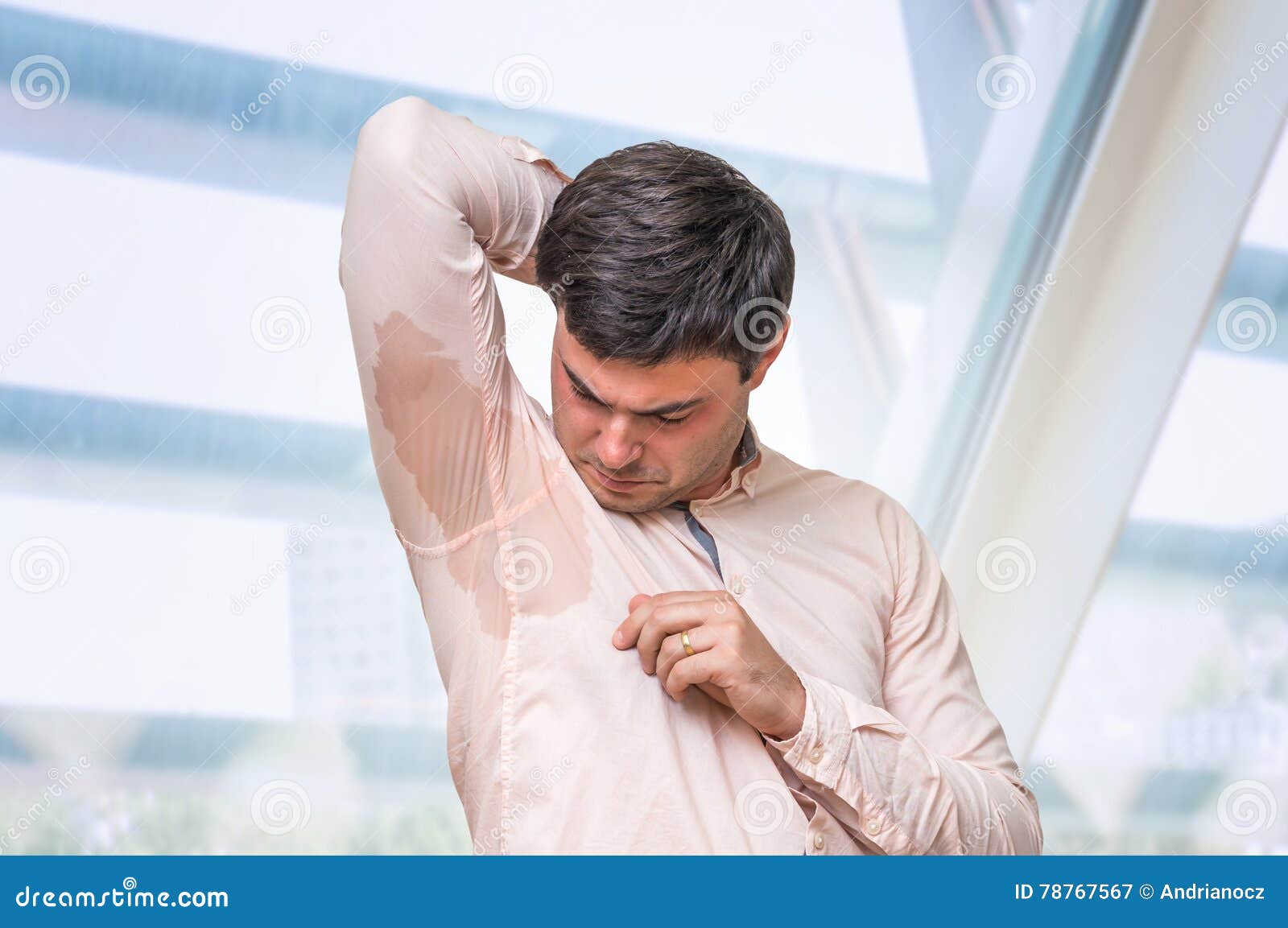 Man with Hyperhidrosis Sweating Under Armpit in Office Stock Image ...