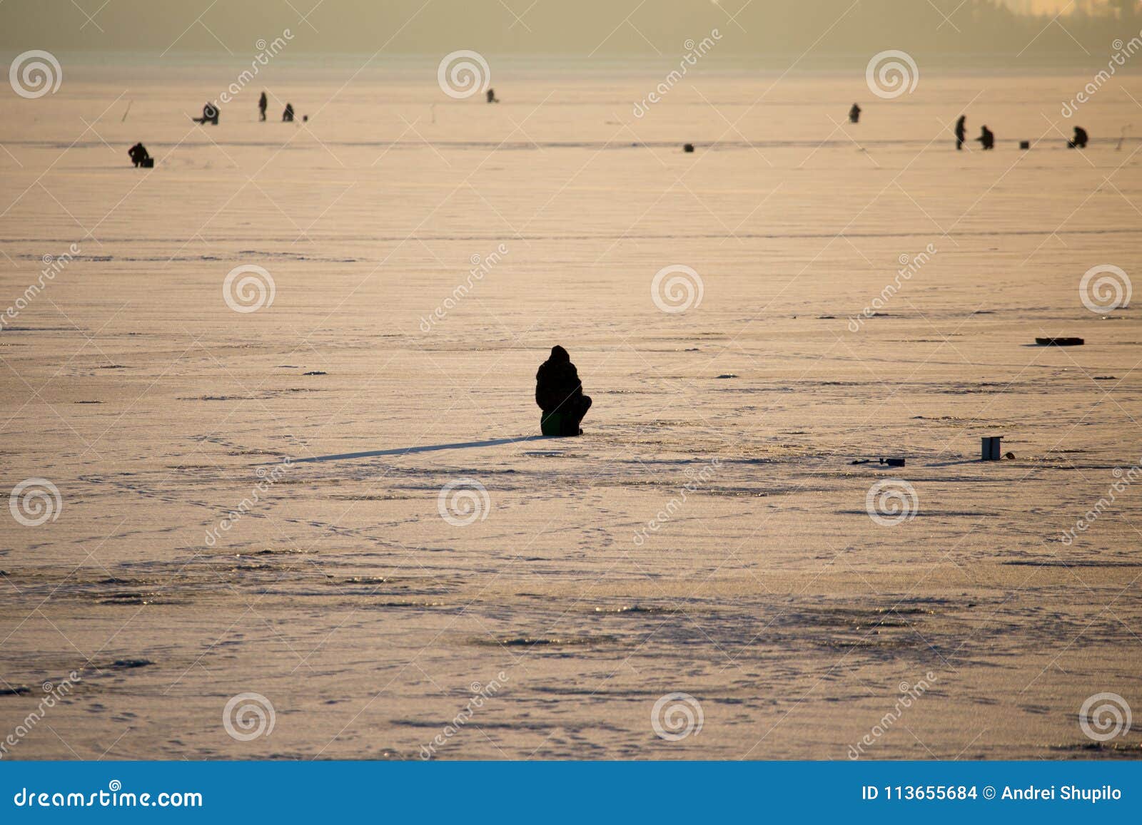 A Man on Ice is Fishing in the Evening Stock Photo - Image of landscape ...