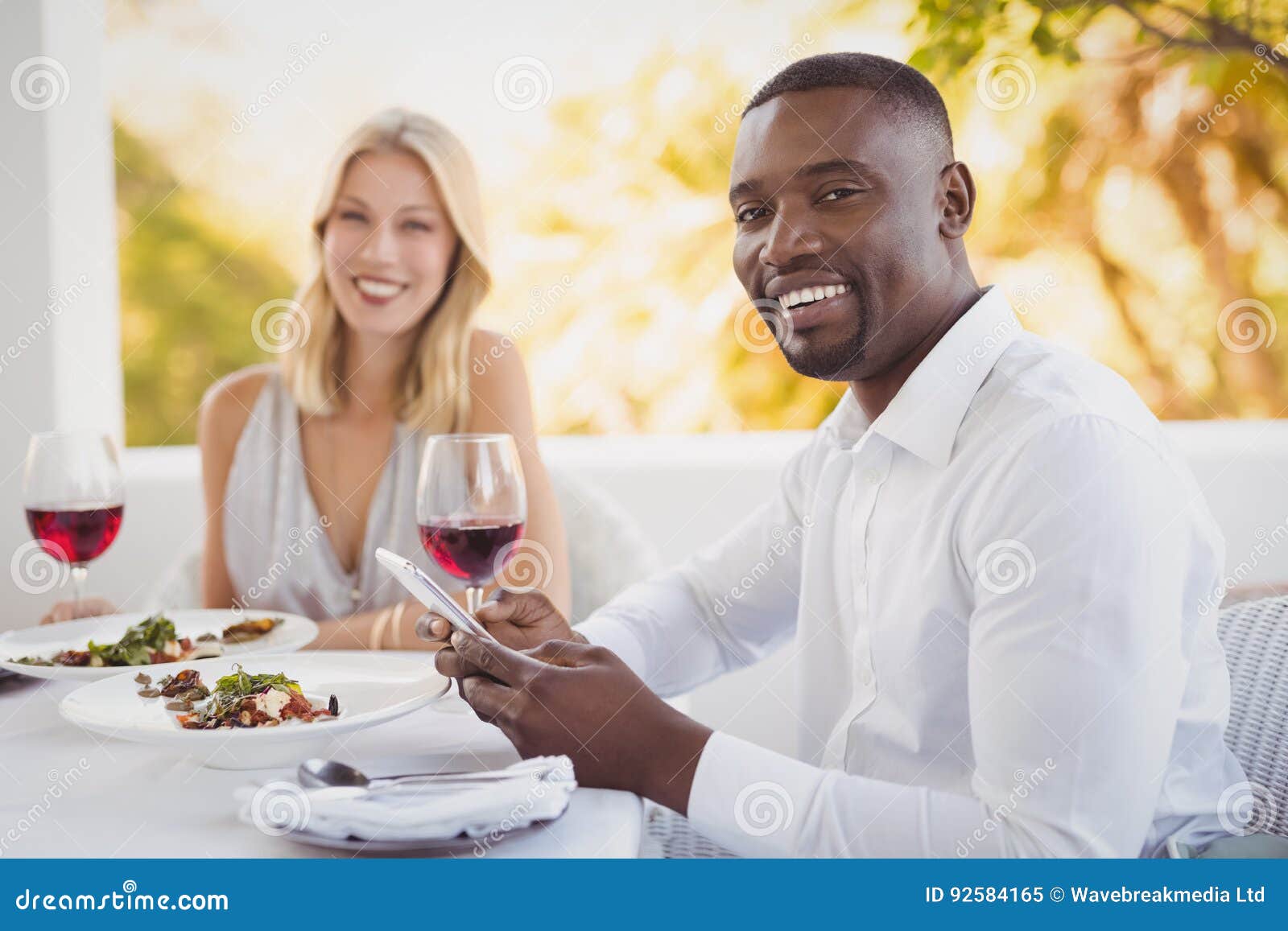 Man Ignoring Bored Woman while Using Mobile Phone Stock Image - Image ...